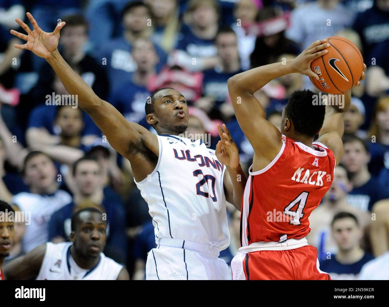 Connecticut's Lasan Kromah (20) guards Rutgers' Myles Mack (4) during ...
