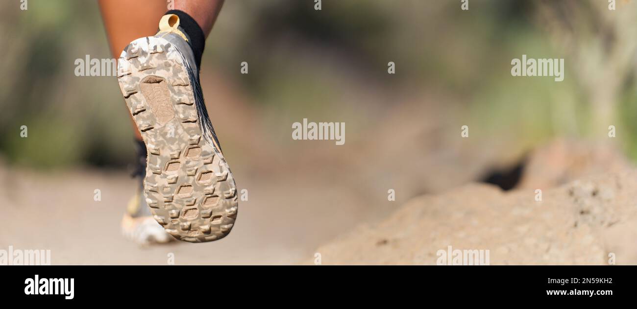 Athlete running sport feet on trail, selective focus on sole.Training ...