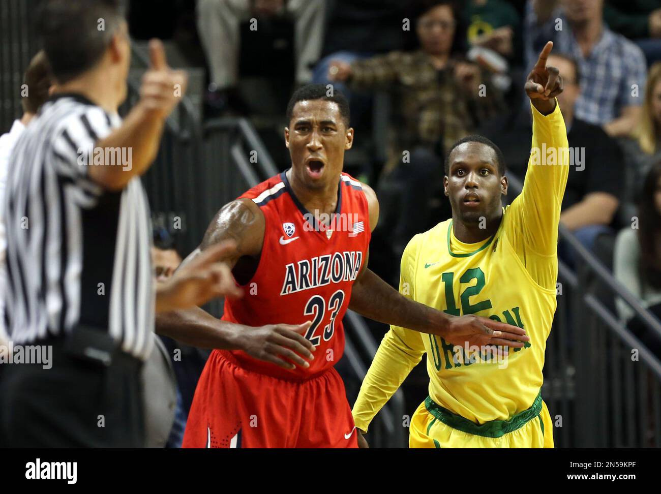 Arizona's Rondae Hollis-Jefferson, center, reacts to an official's call ...