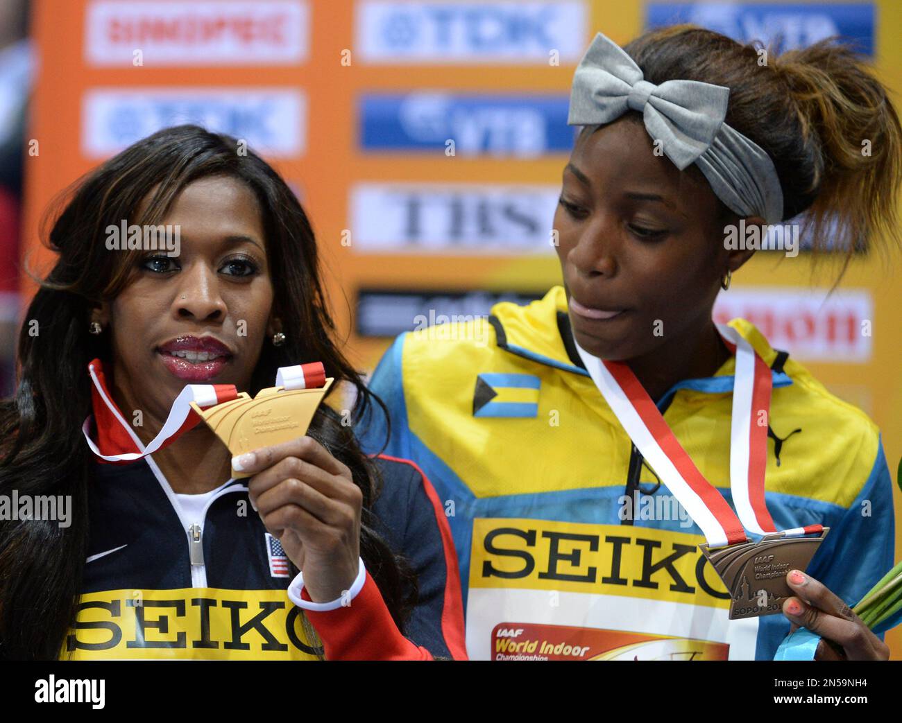 Bahamas' bronze medal winner Shaunae Miller, right, looks to gold medal ...