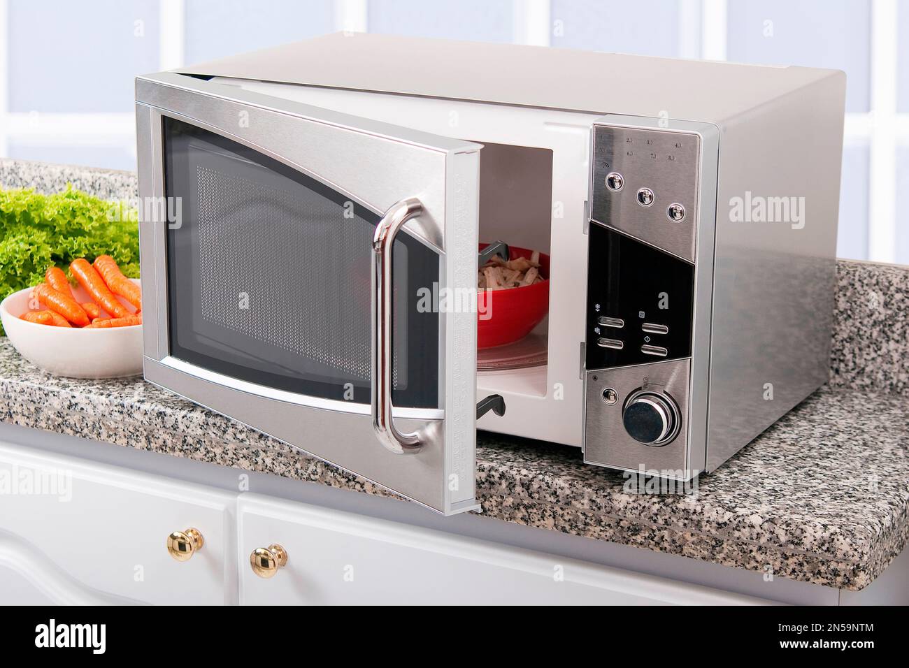 Microwave oven; photo in kitchen environment Stock Photo - Alamy