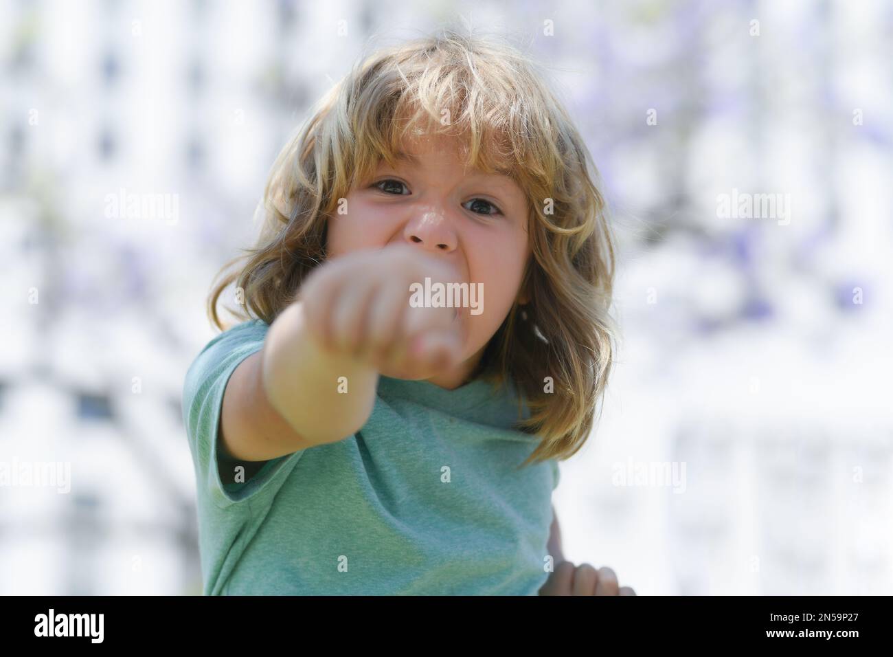 Boy fight with fist gesture punch. Child with angry expression. Angry ...