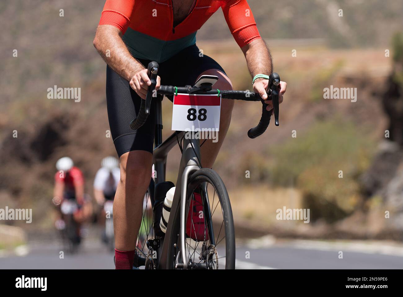 Cycling competition,cyclist athletes riding a race, climbing up a hill ...