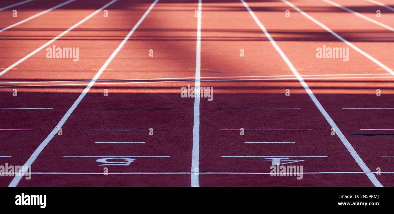 Red running track. Track and field or athletics track finish line with ... Red running track. Track and field or athletics track finish line with ...
