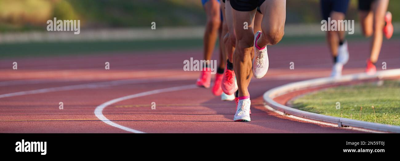 Athletics people running on the track field.Running a race on a track ...