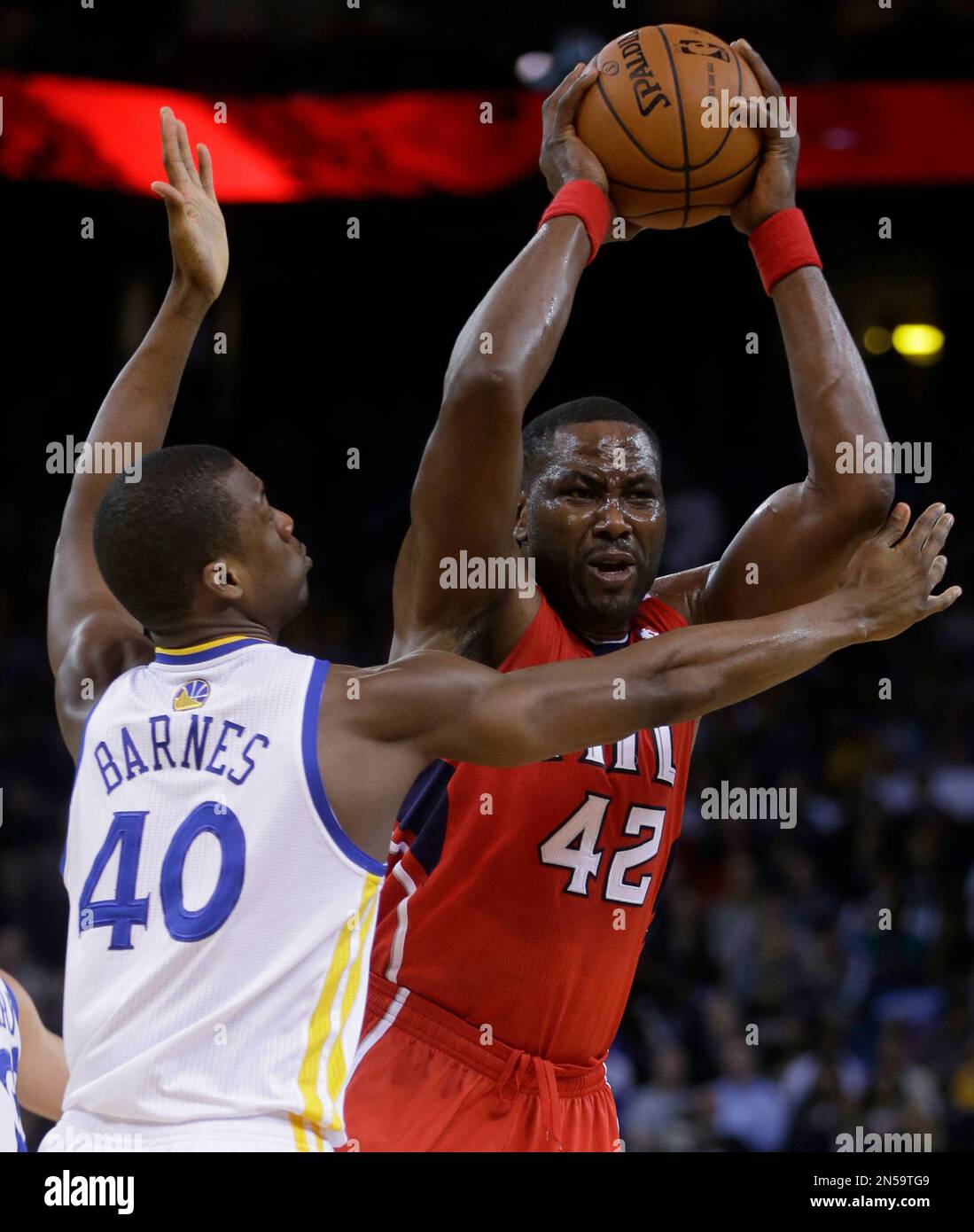 Atlanta Hawks' Elton Brand, right, looks to pass away from Golden State ...