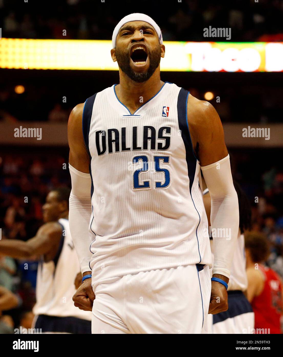 Dallas Mavericks guard/forward Vince Carter (25) shouts after scoring ...