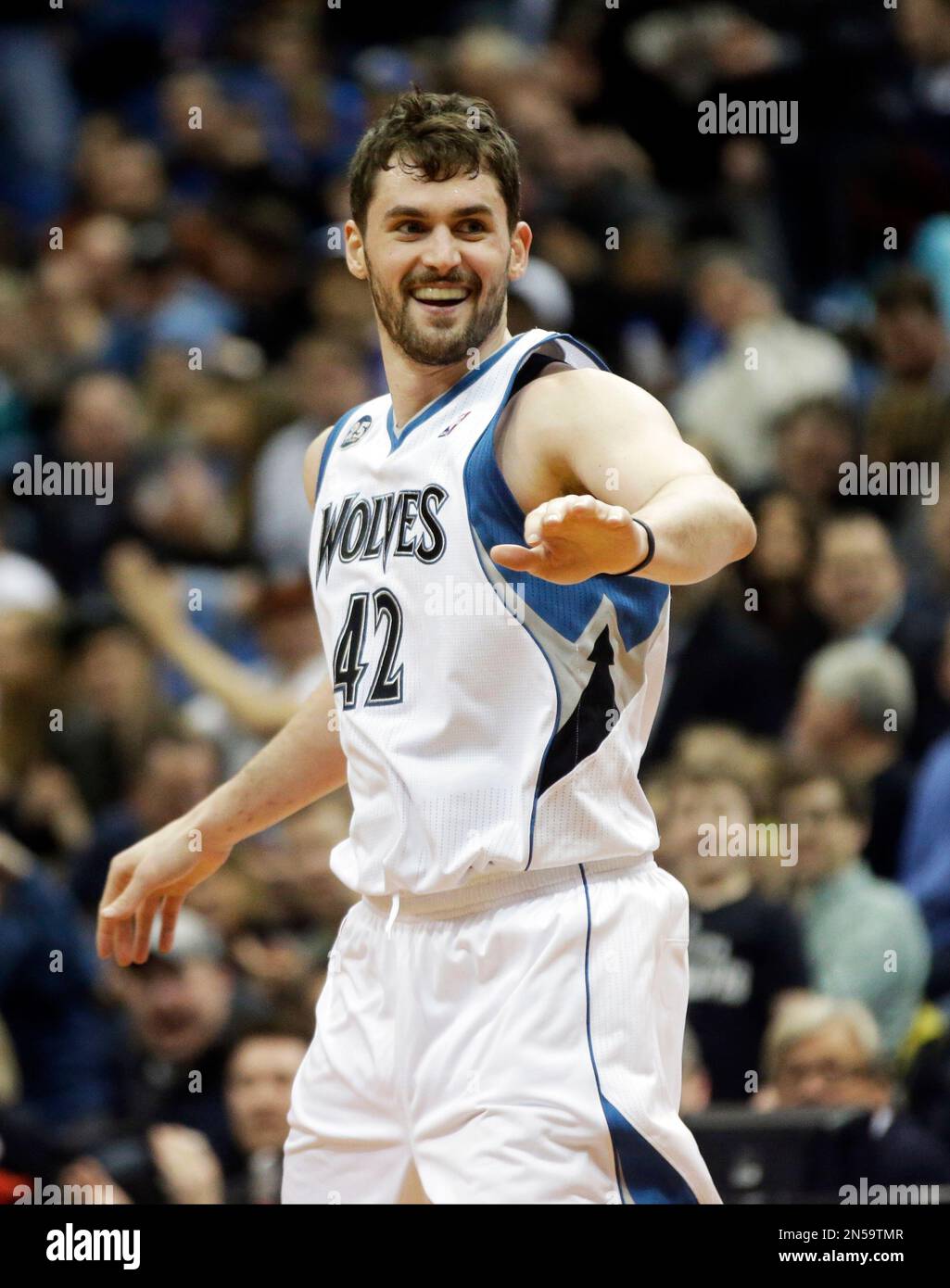 Minnesota Timberwolves' Kevin Love , left, congratulates Corey Brewer ...