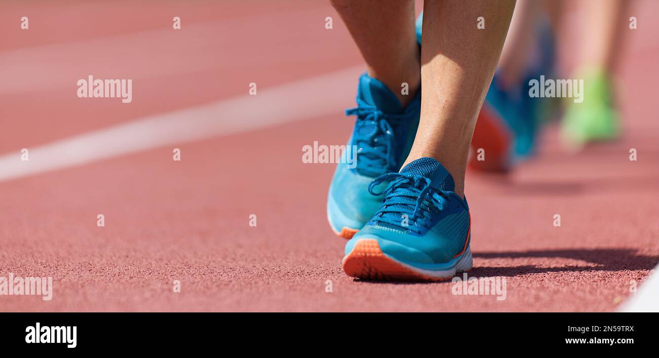 Athletes on track in race walk competition, race walking on athletic ...