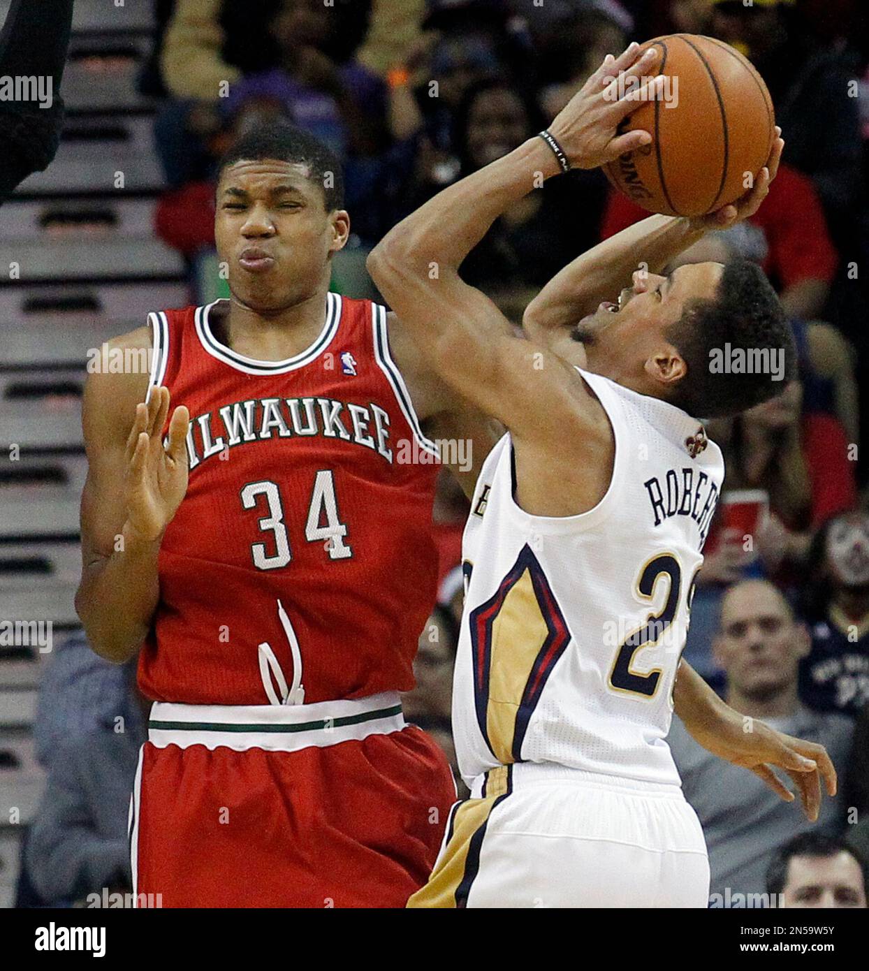 New Orleans Pelicans guard Brian Roberts (22) bumps into Milwaukee ...