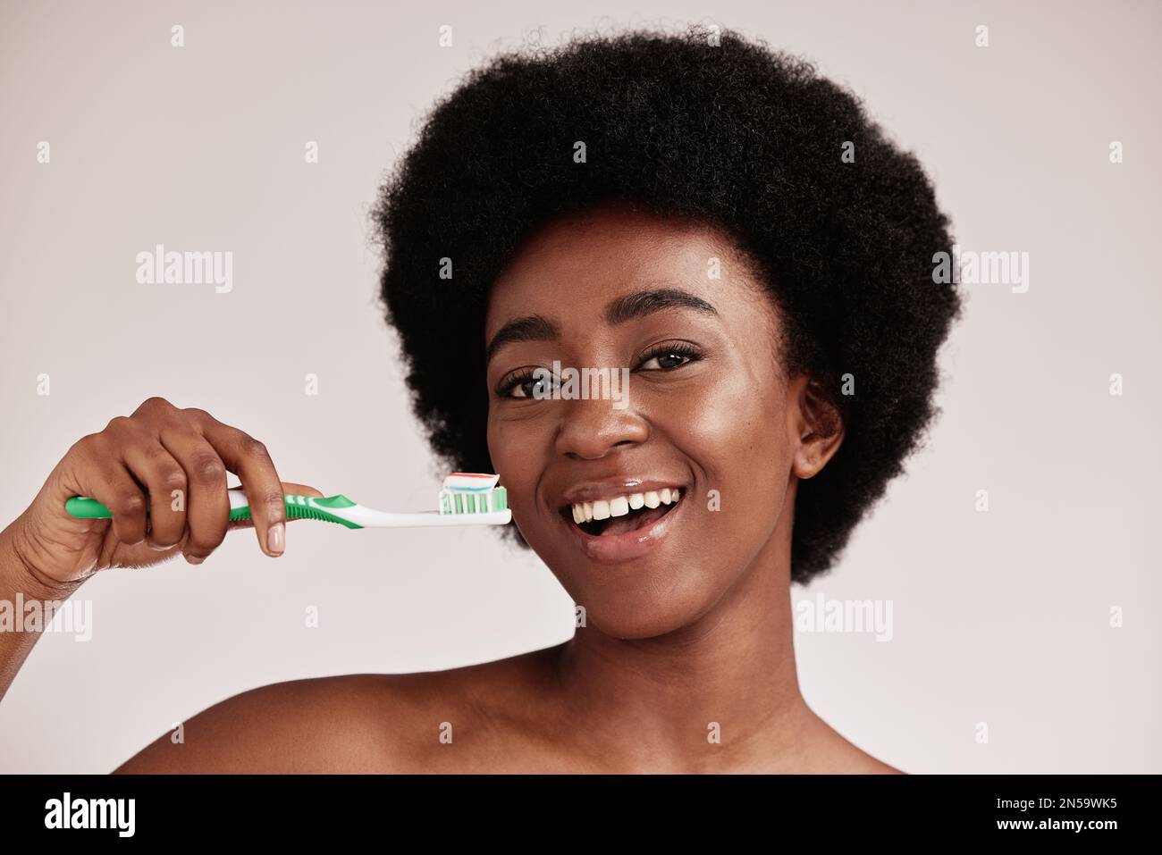 Brushing teeth, black woman and toothbrush portrait for clean and healthy mouth on studio ...