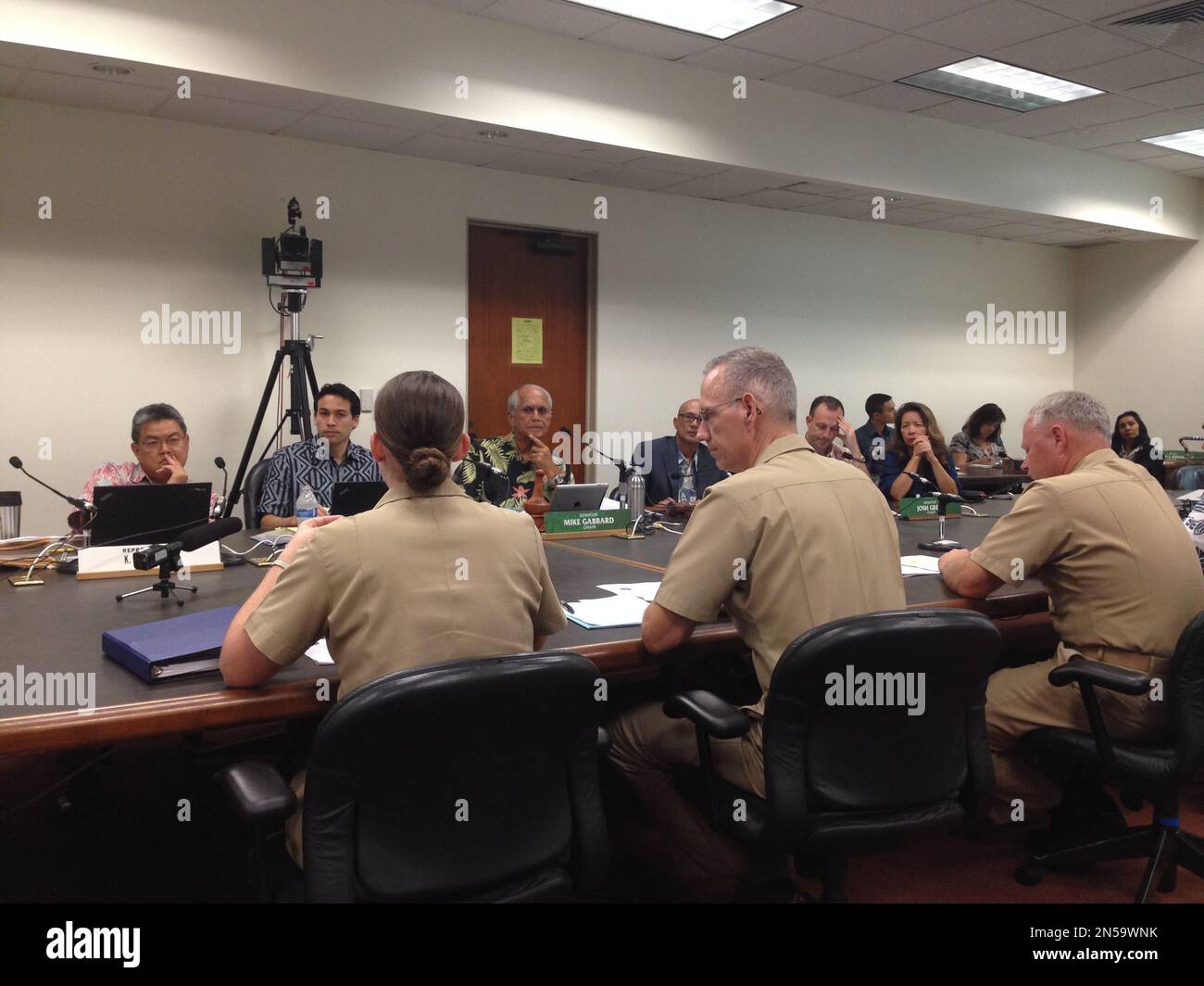 Navy officials including Capt. Mark Wheeler, commanding officer of ...