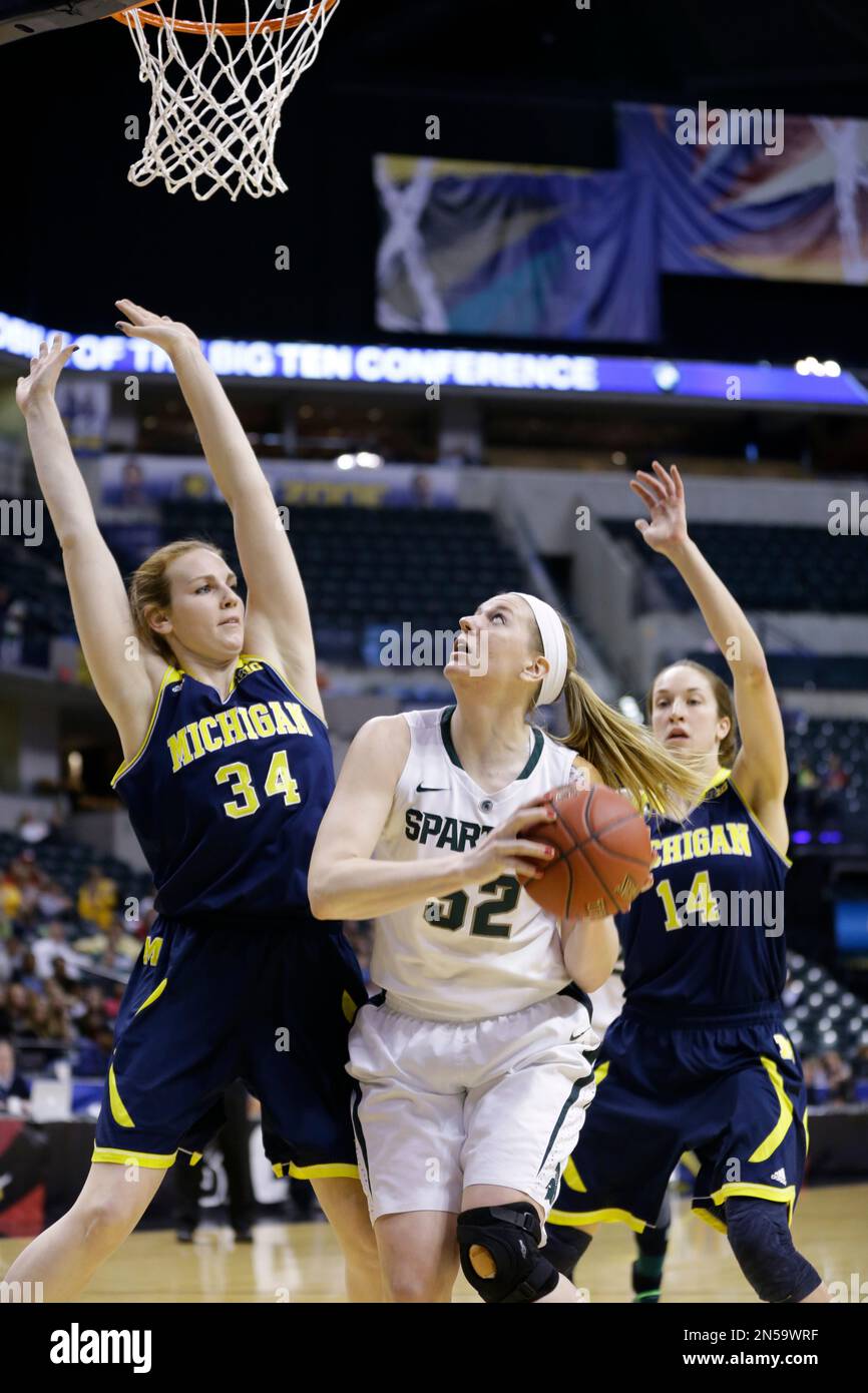 Michigan State forward Becca Mills (52) looks to shoot between Michigan ...