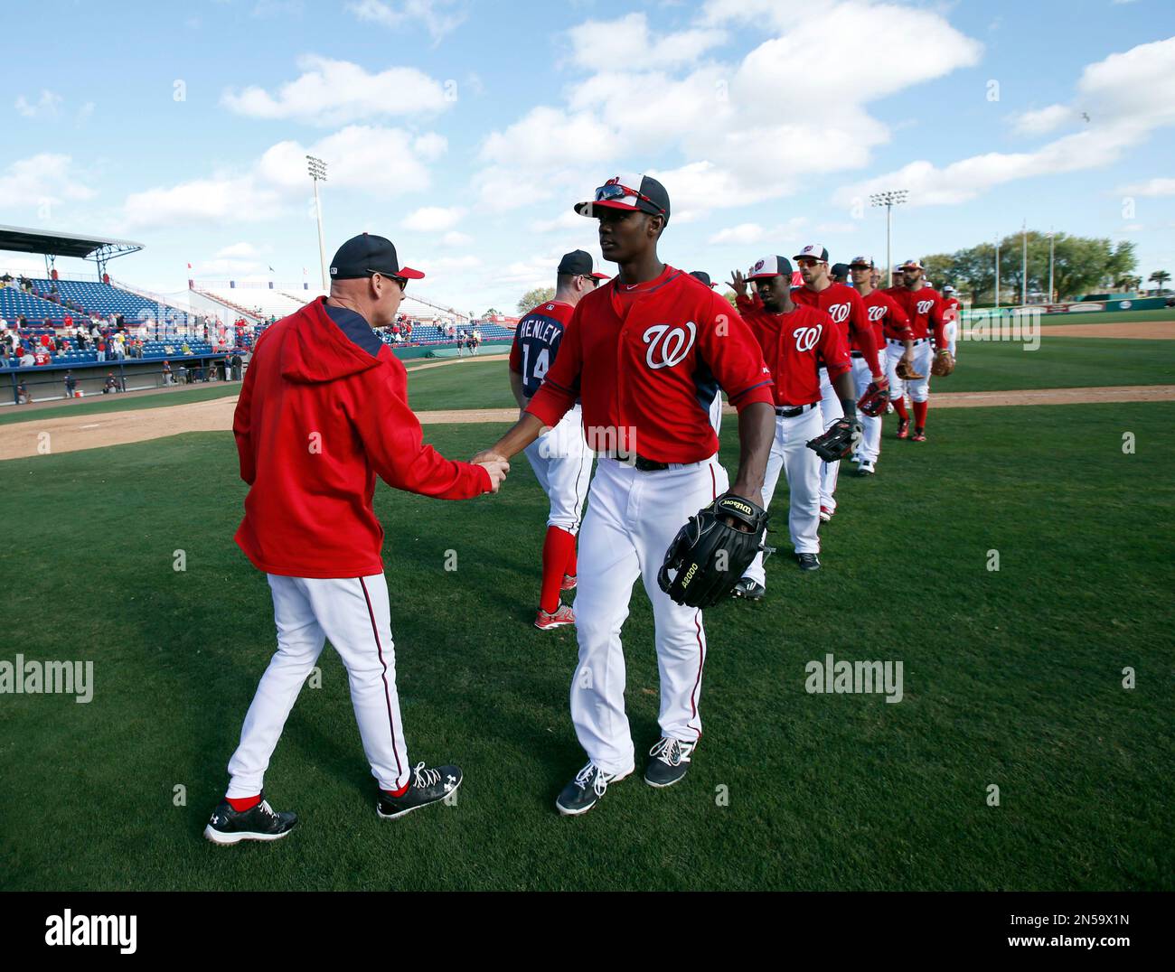 Washington Nationals manager Matt Williams, left, celebrates with ...