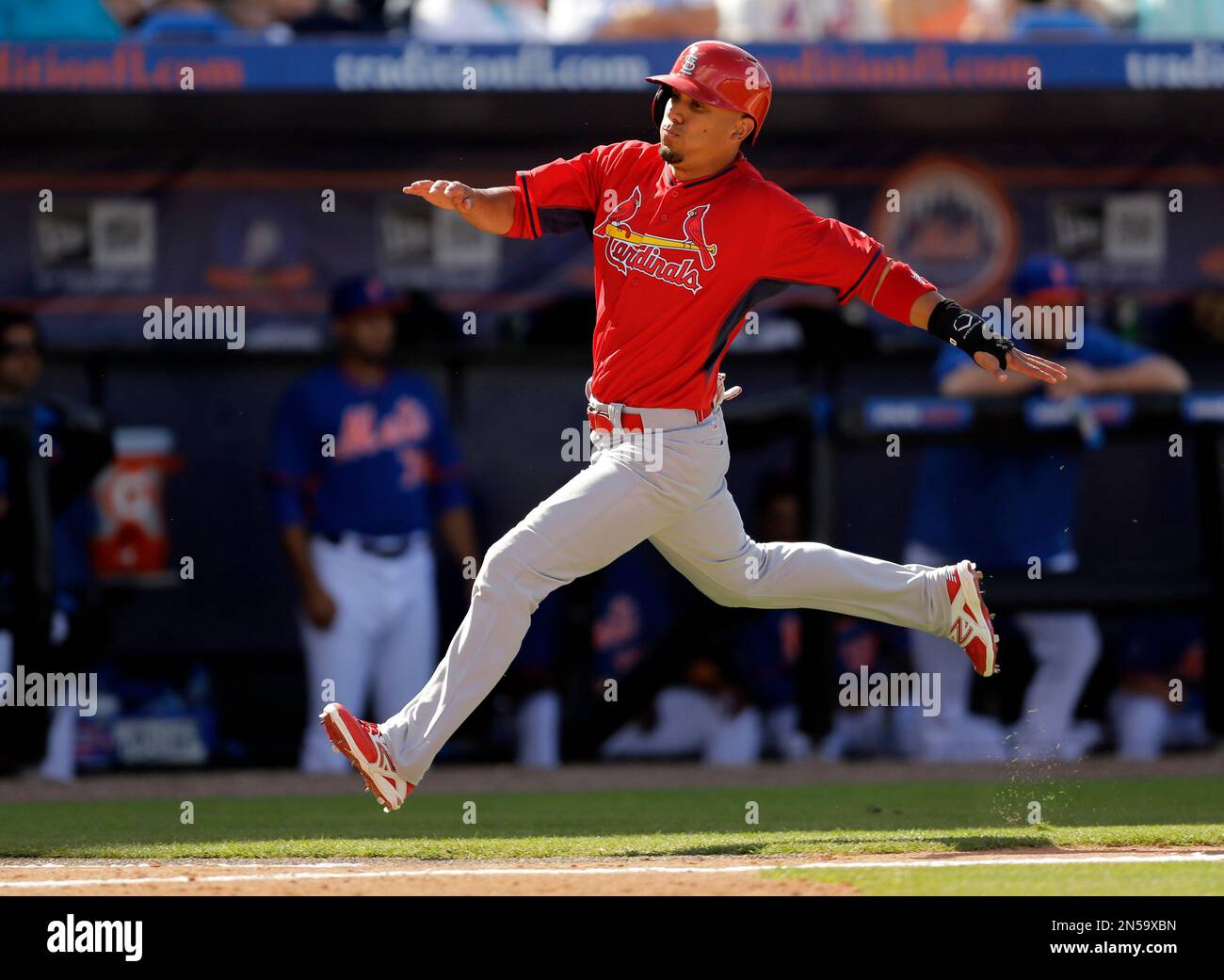 St. Louis Cardinals' Rafael Ortega scores on a single by Kolten Wong ...