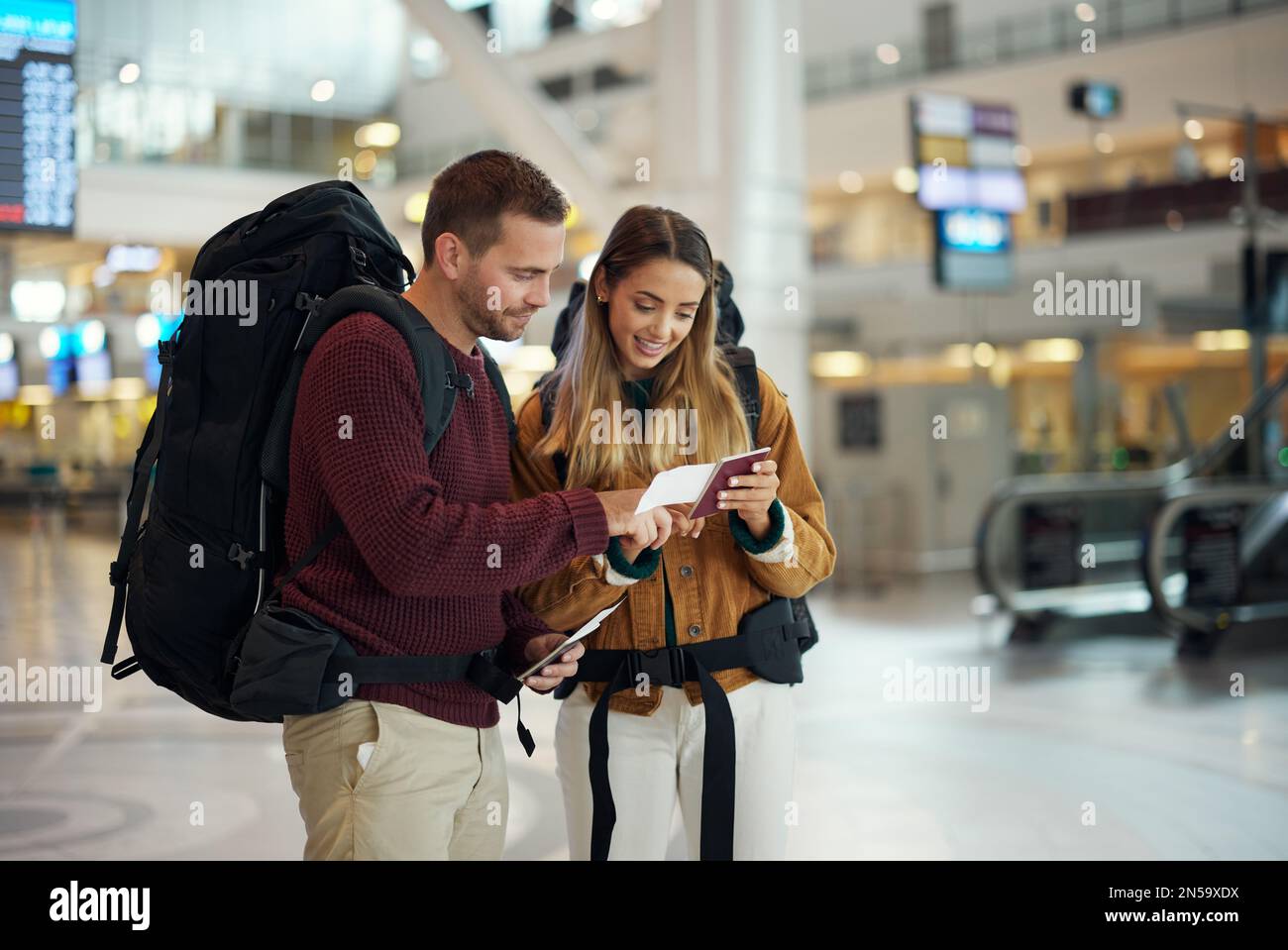 Love, couple and in airport with passport, traveling and check passport ...