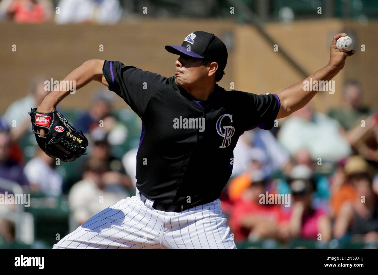 Colorado Rockies starting pitcher Jorge De La Rosa throws to the Los ...