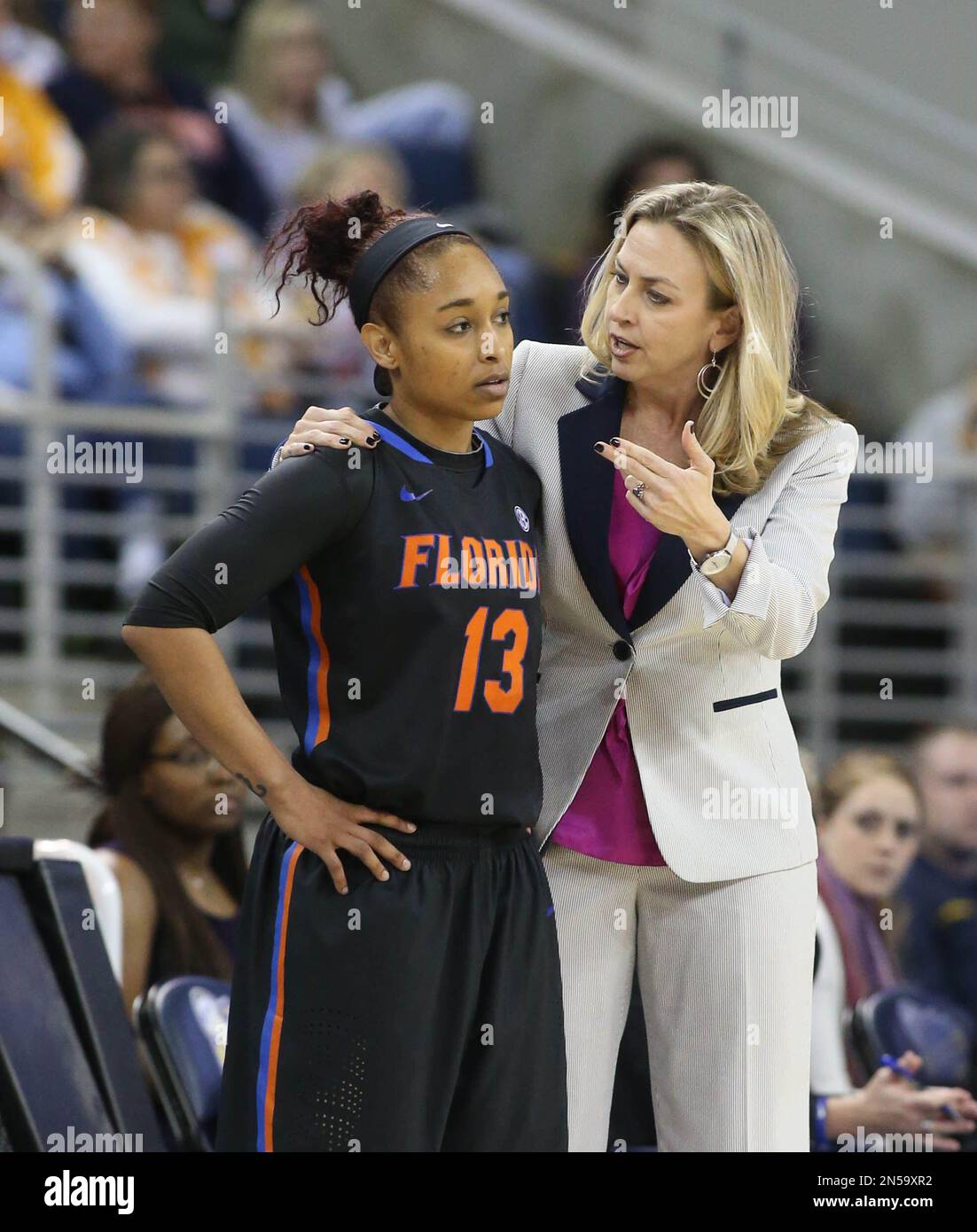 Florida coach Amanda Butler, right, talks with Florida guard Cassie ...