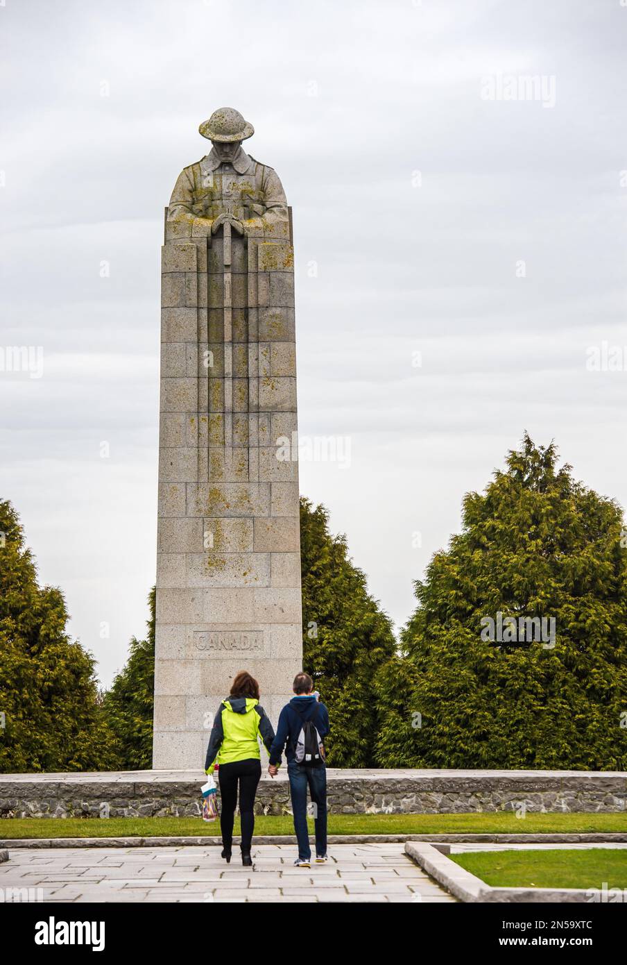 Two people walk toward the World War One Canadian Memorial, also known ...