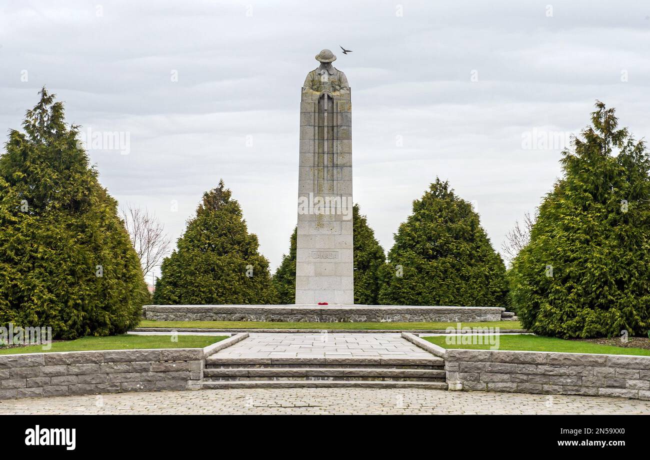 A bird flies over the World War One Canadian Memorial, also known as ...