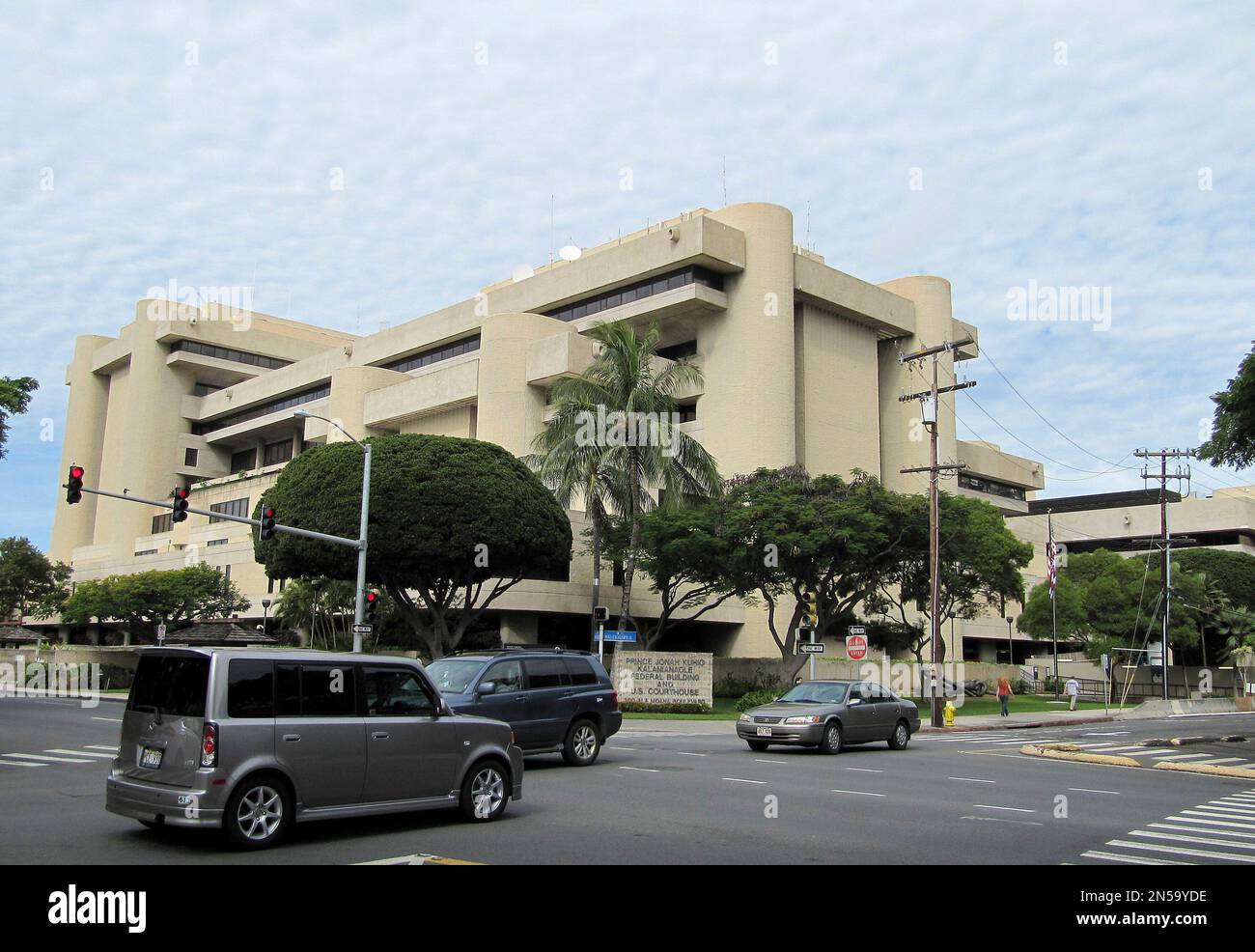 Cars pass in front of the federal building housing U.S. District Court ...