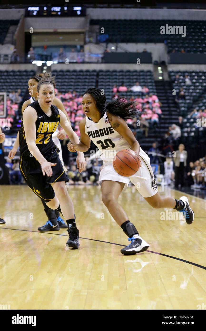 Purdue guard Dee Dee Williams, right, drives on Iowa guard Samantha ...