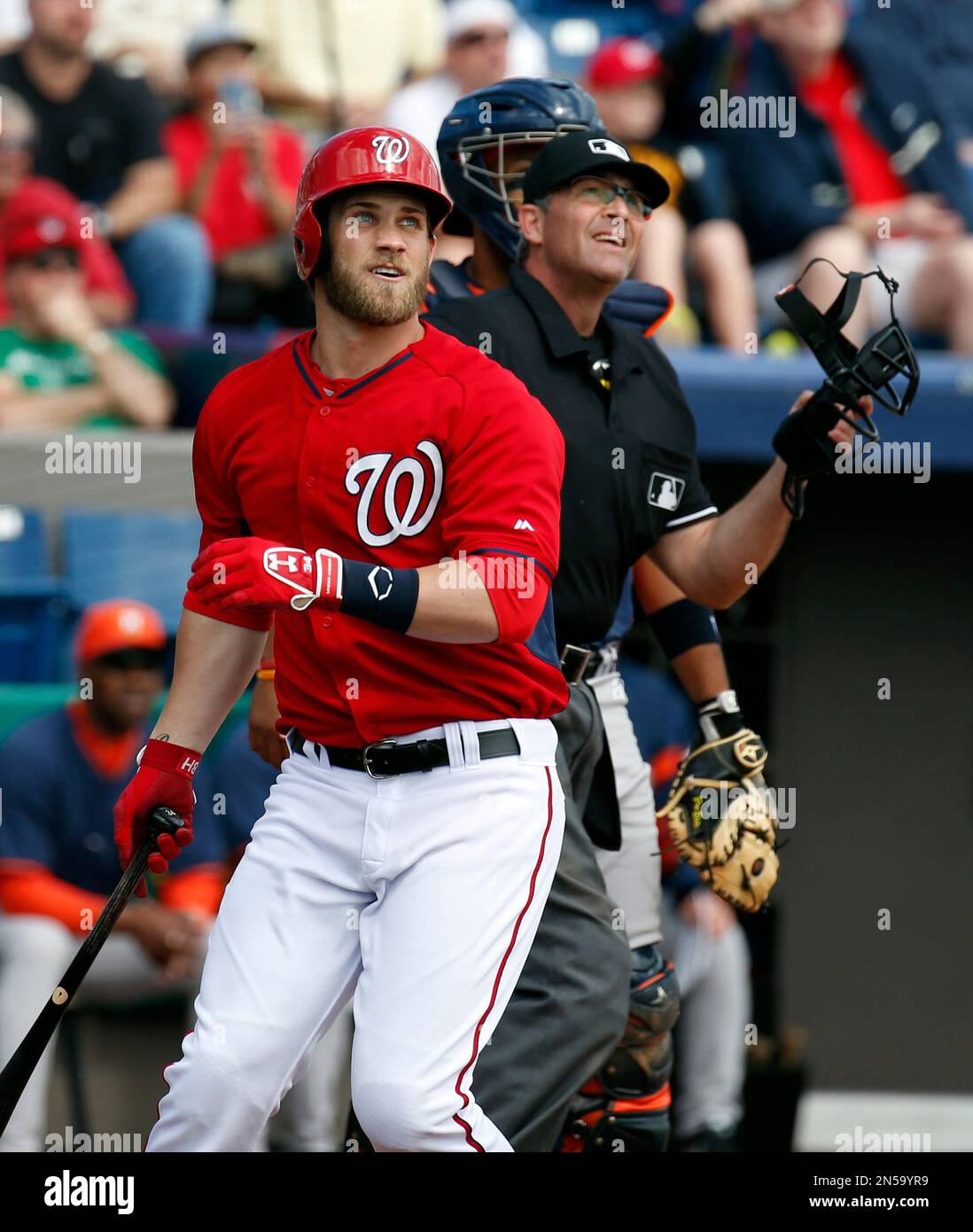 Washington Nationals' Bryce Harper, left, watches his two-run homer ...