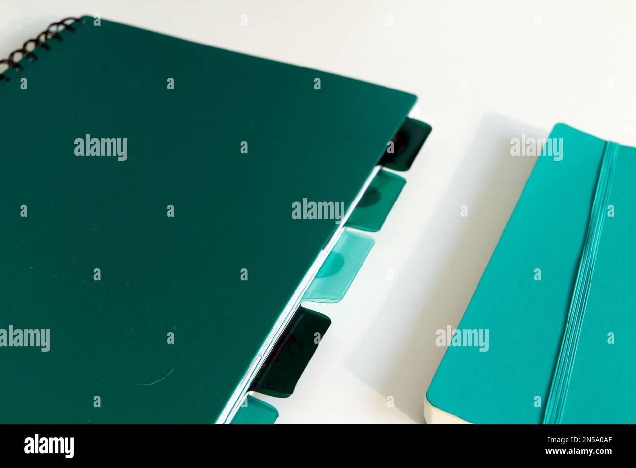 green notebooks with tags isolated on white background with copyspace ...