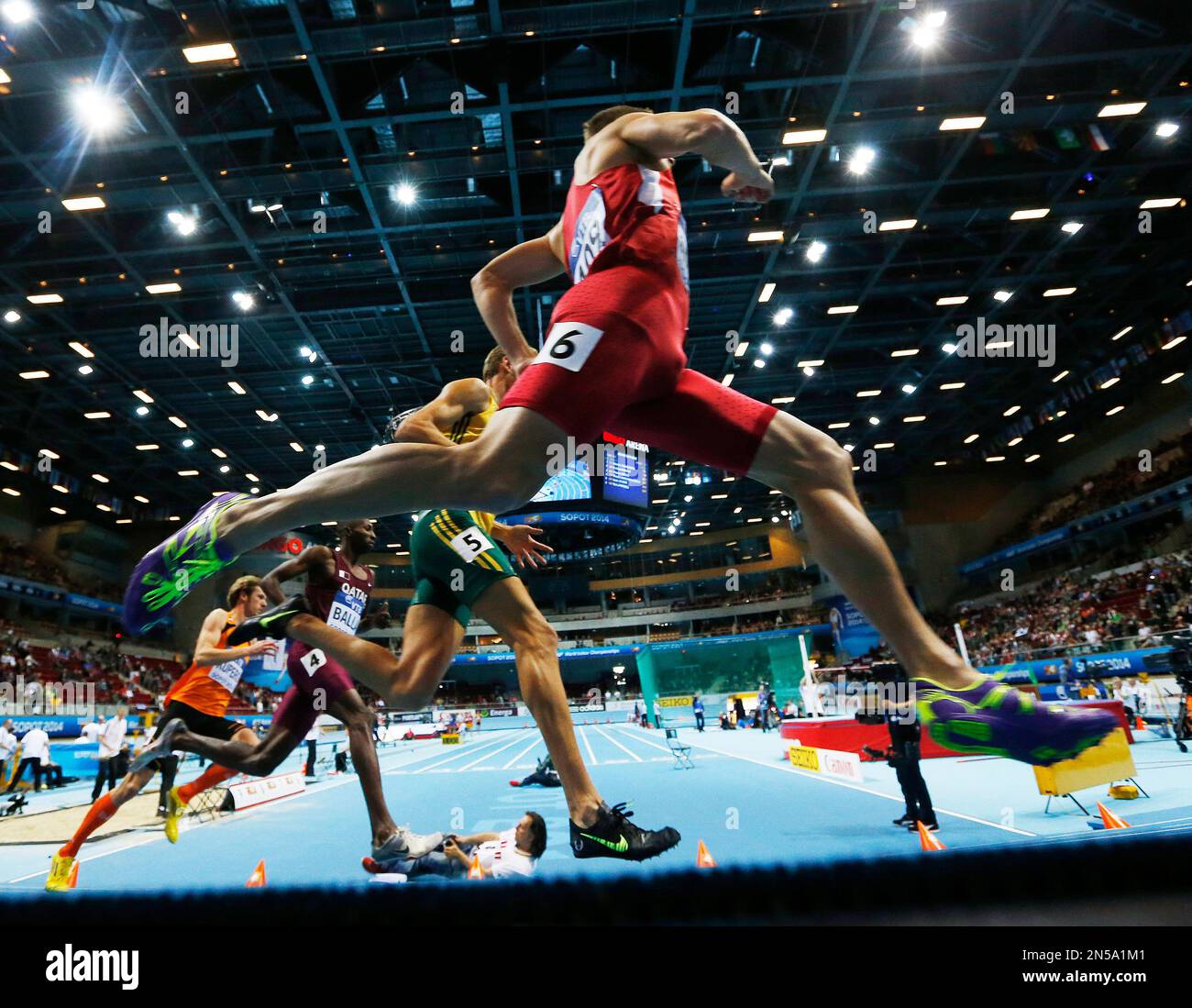 Athletes run in a men's 800m heat during the Athletics World Indoor ...