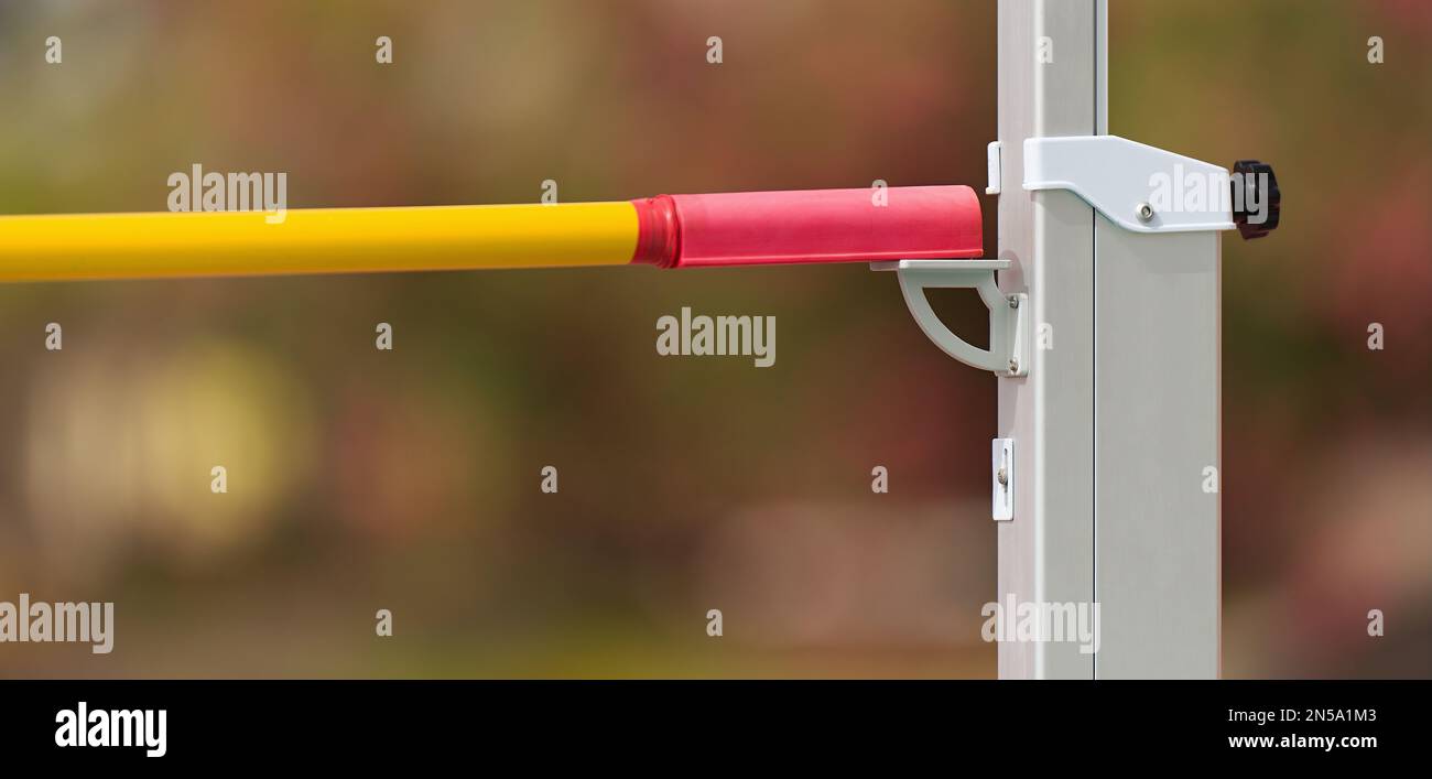 Measuring the high jump athletics with nice background, high jump over ...