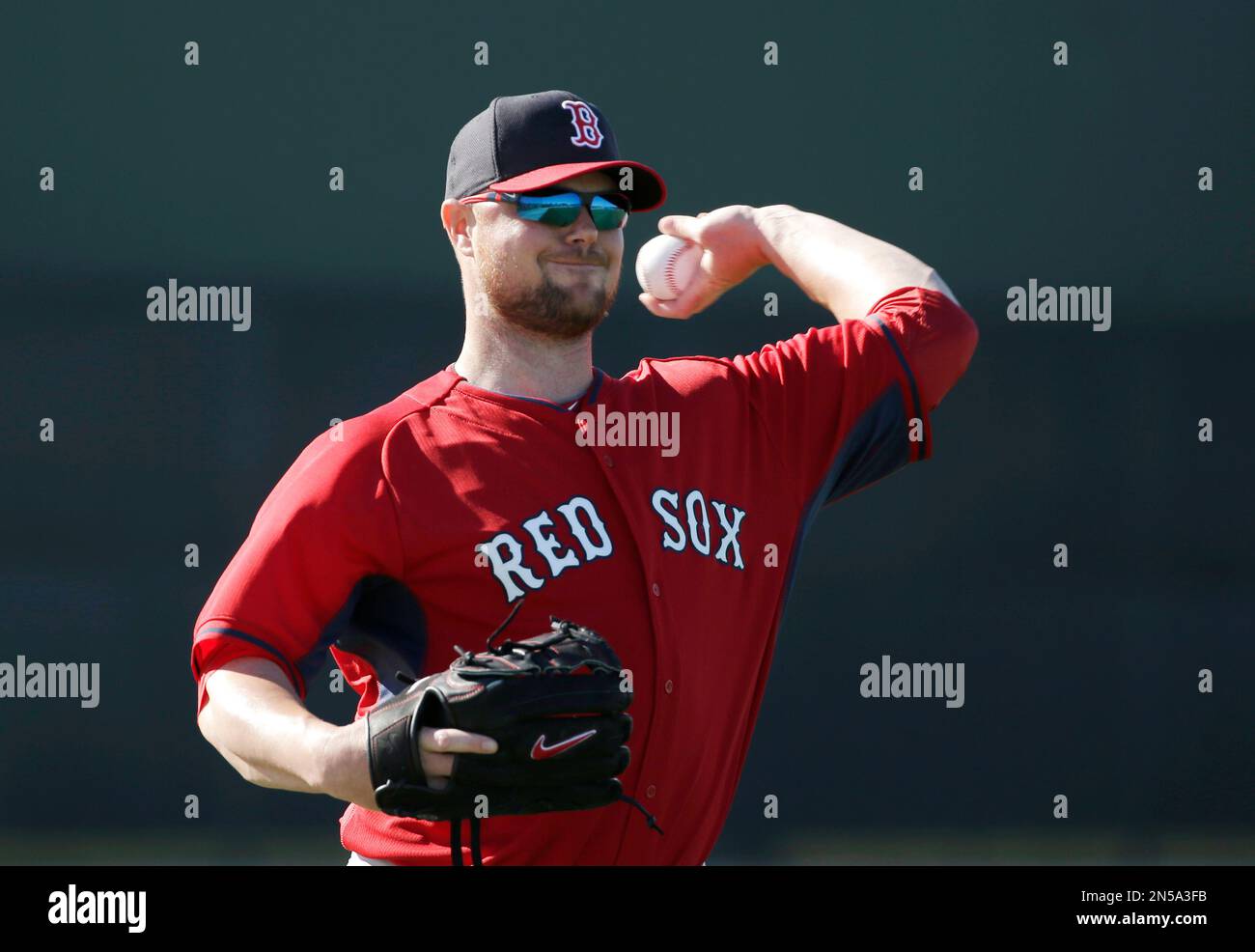 Boston Red Sox starting pitcher Jon Lester winds up for a throw during ...