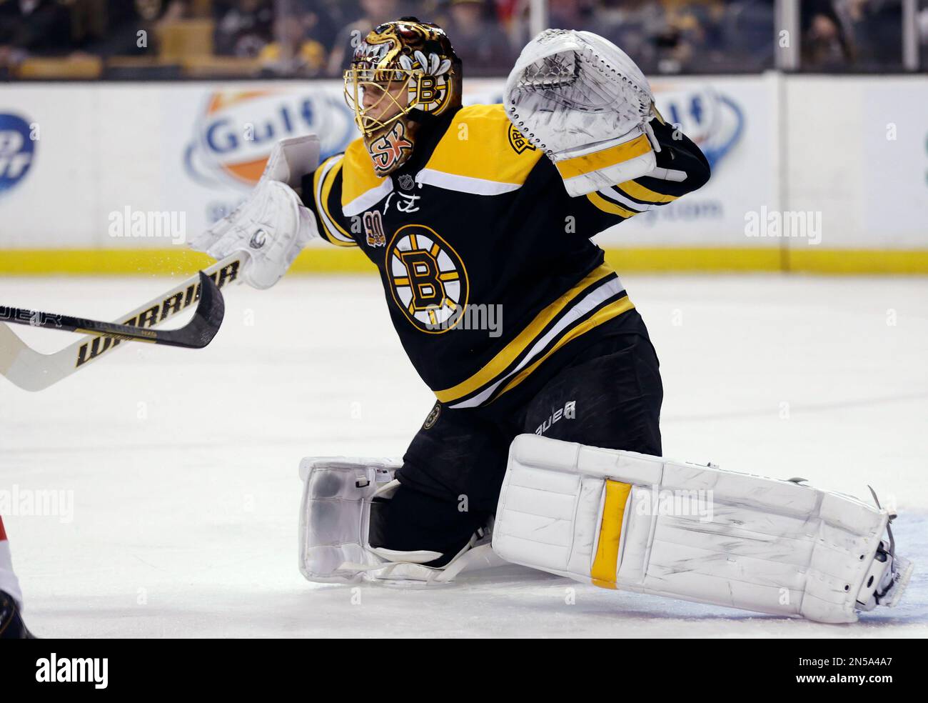 Boston Bruins goalie Tuukka Rask drops to the ice on a save against the ...
