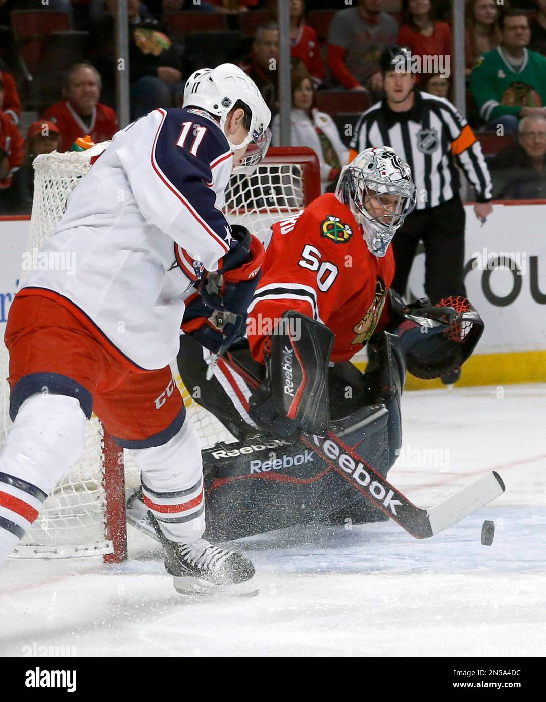 Chicago Blackhawks goalie Corey Crawford (50) makes a save on a shot by ...