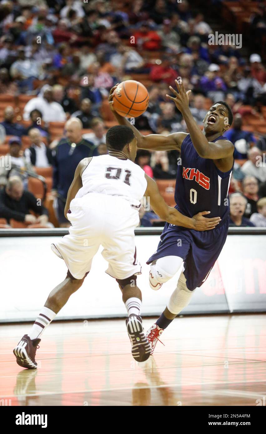 Beaumont Central's Michael Jacquet (31) tries to slow down Dallas ...