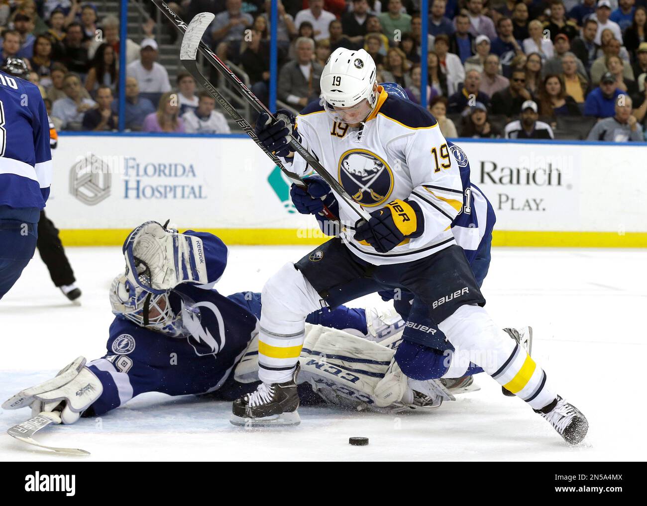 Buffalo Sabres center Cody Hodgson (19) battles for the puck in front ...