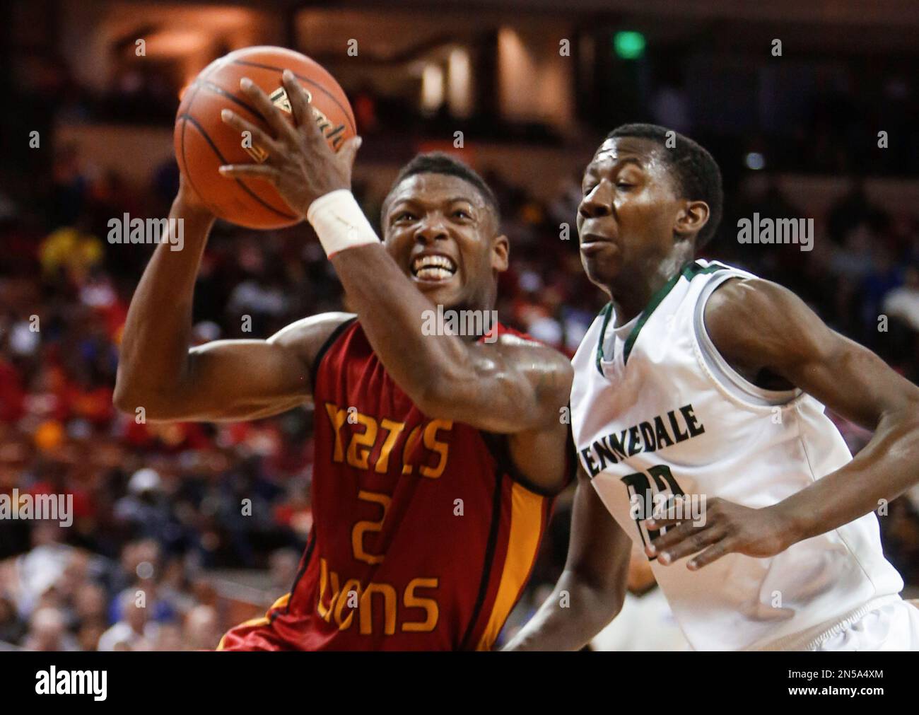Houston Yates' Damion Lewis (2) drives past Kennedale's VJ Hughes (22 ...