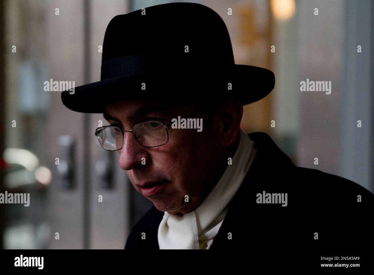 The Rev. Andrew McCormick walks from the center for criminal justice Thursday, March 6, 2014, in ...