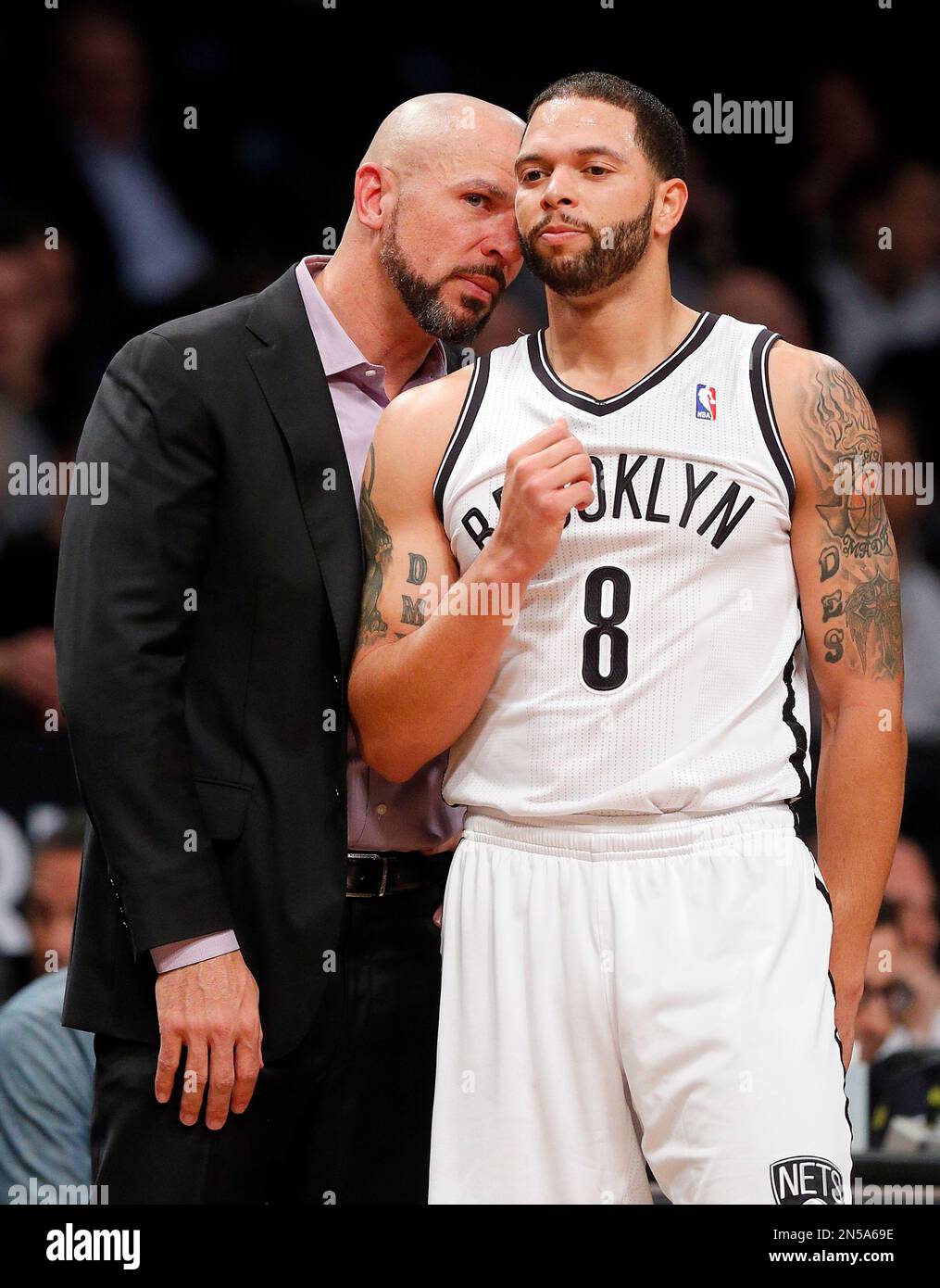 Brooklyn Nets head coach Jason Kidd talks with Brooklyn Nets point guard Deron Williams (8) in ...