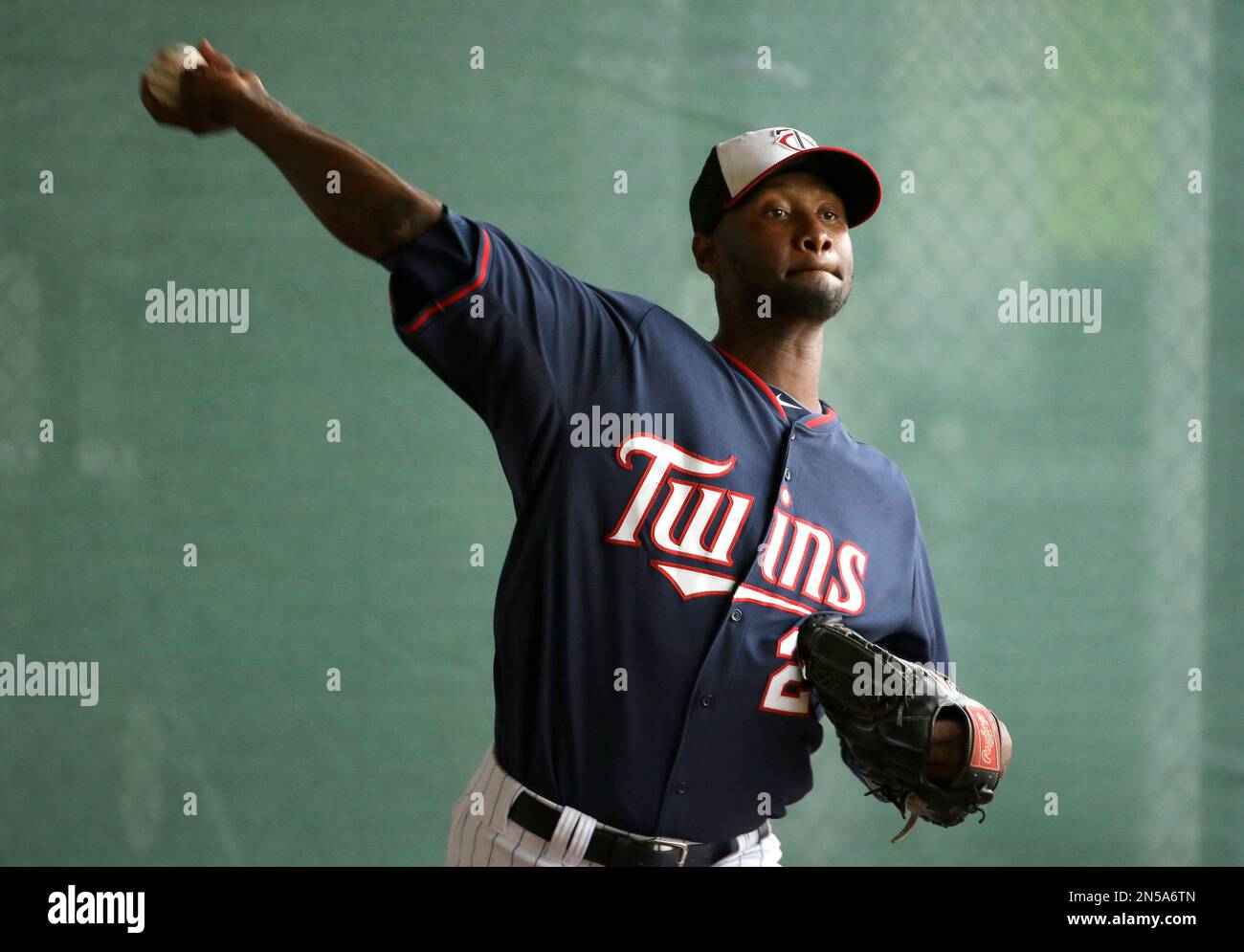 Minnesota Twins pitcher Samuel Deduno works out in the bullpen before ...