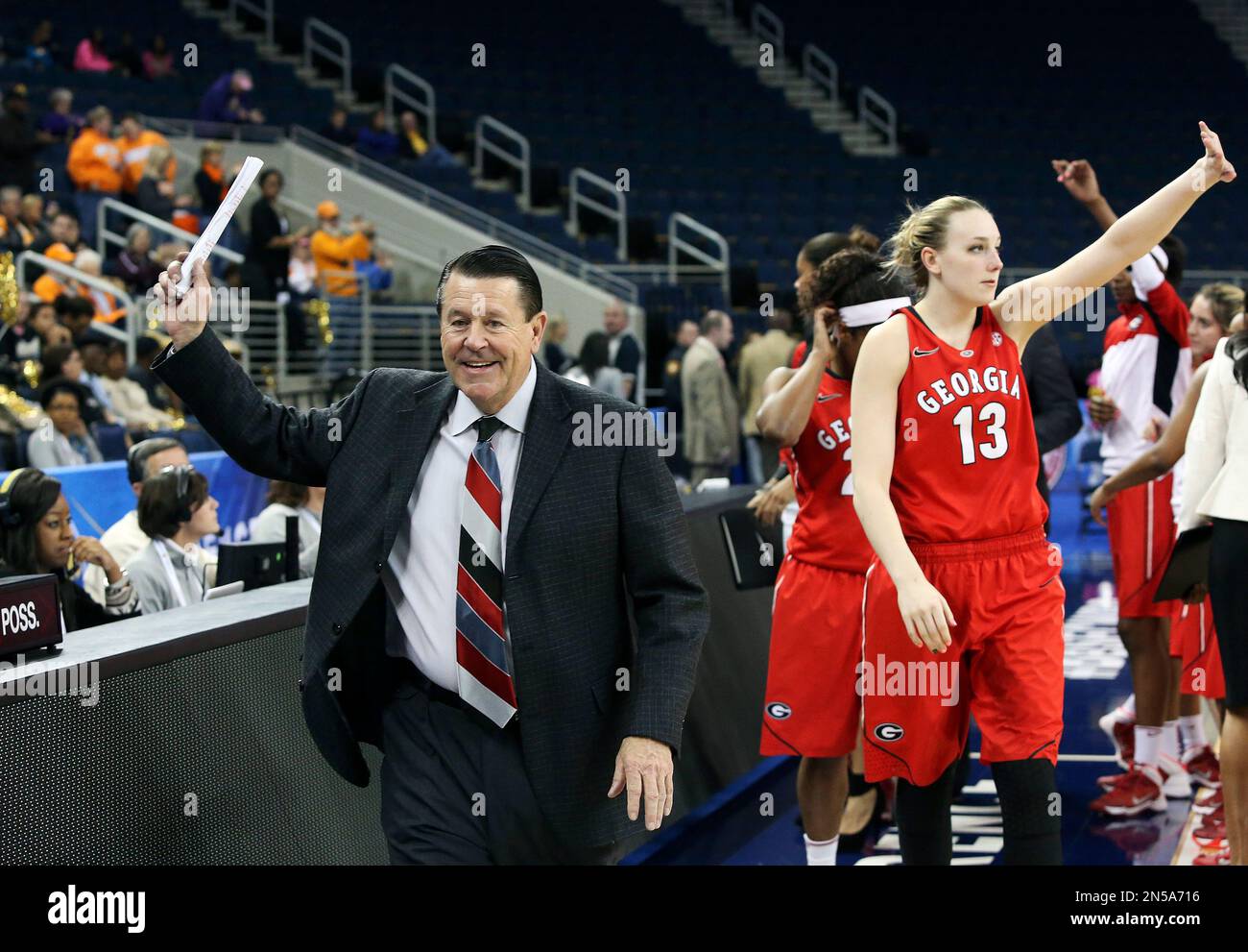 Georgia head coach Andy Landers, left, waves to the crowd as he leaves ...