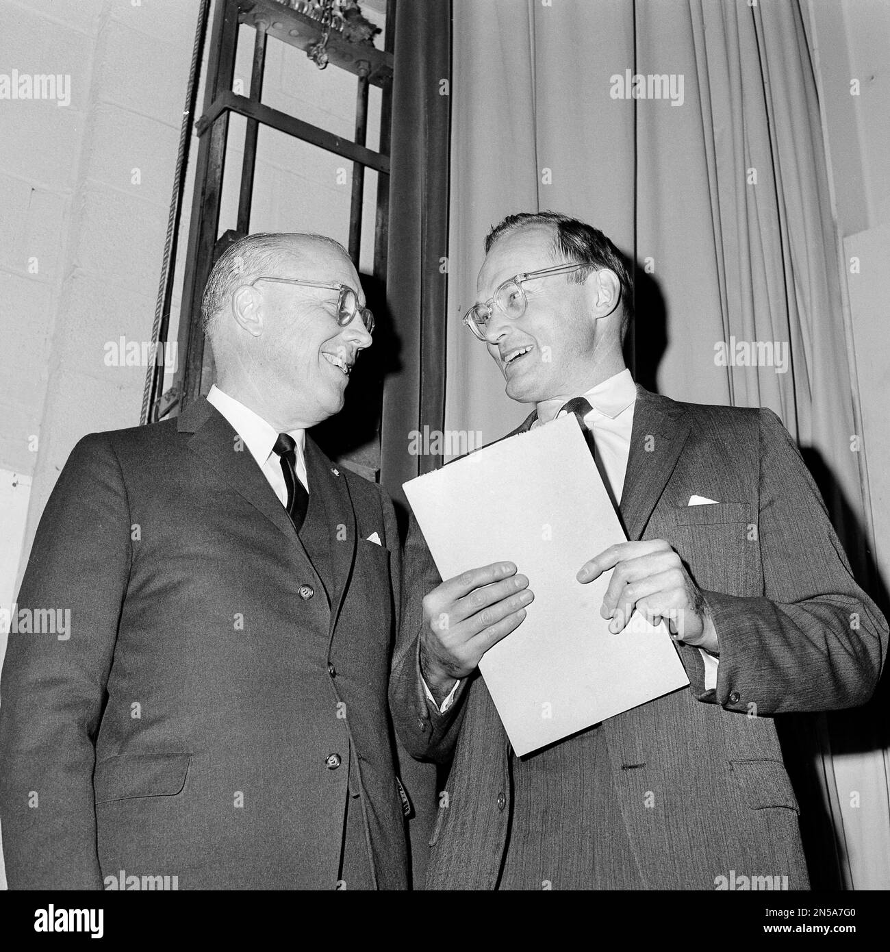 Milton Eisenhower, president of Johns Hopkins University, converses ...
