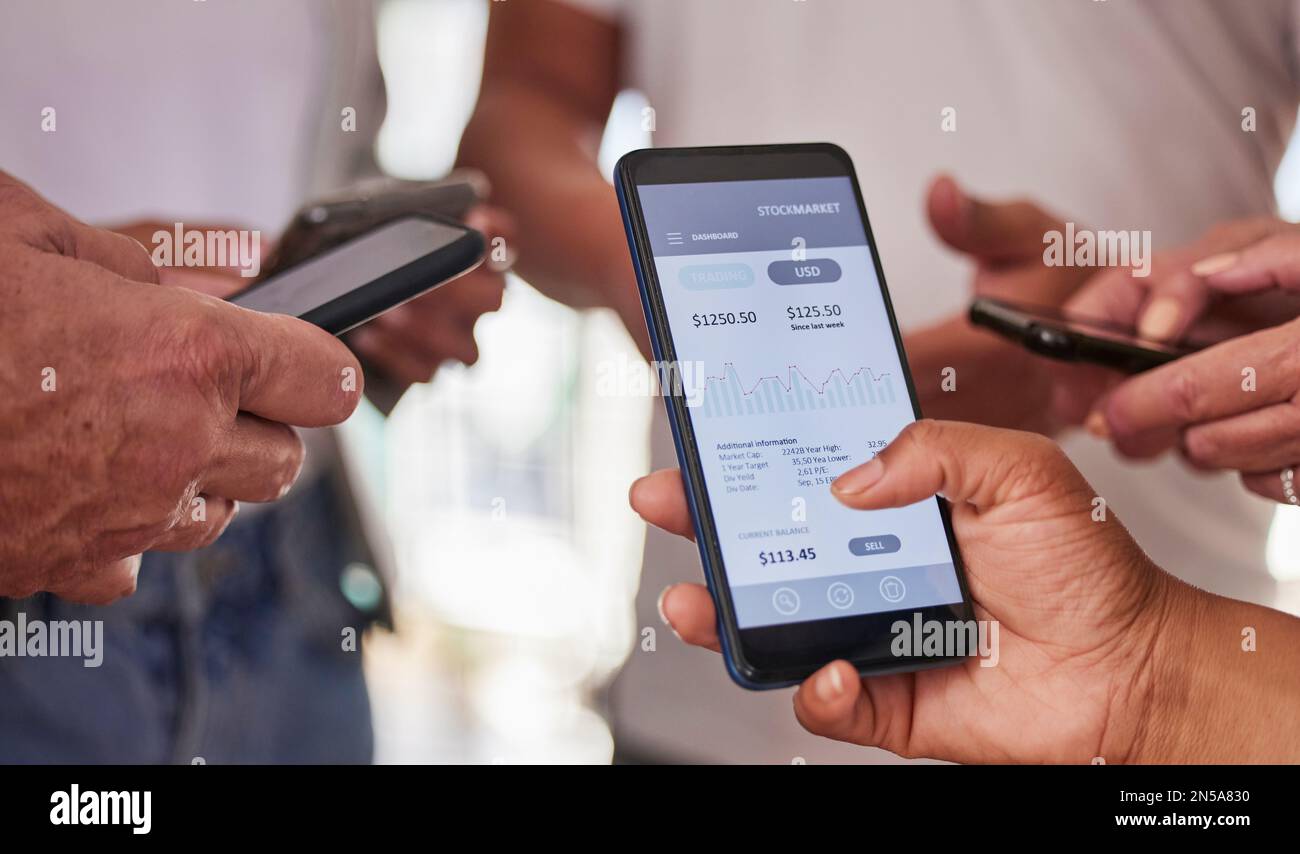 Phone screen, stock market and trading with people hands, fintech and ...