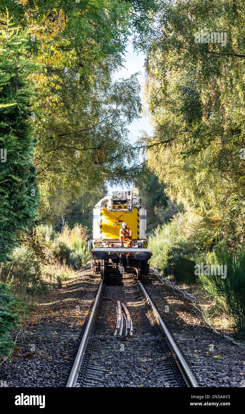 Railway workers building new railway and knocking down bridges Stock ...