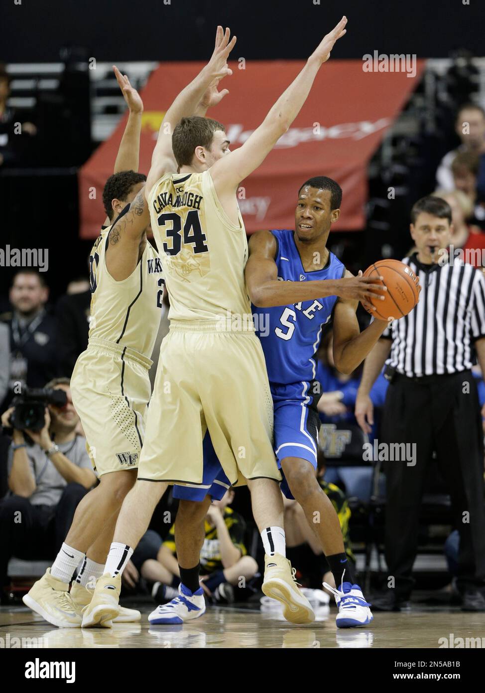 Duke's Rodney Hood (5) is trapped by Wake Forest's Tyler Cavanaugh (34 ...