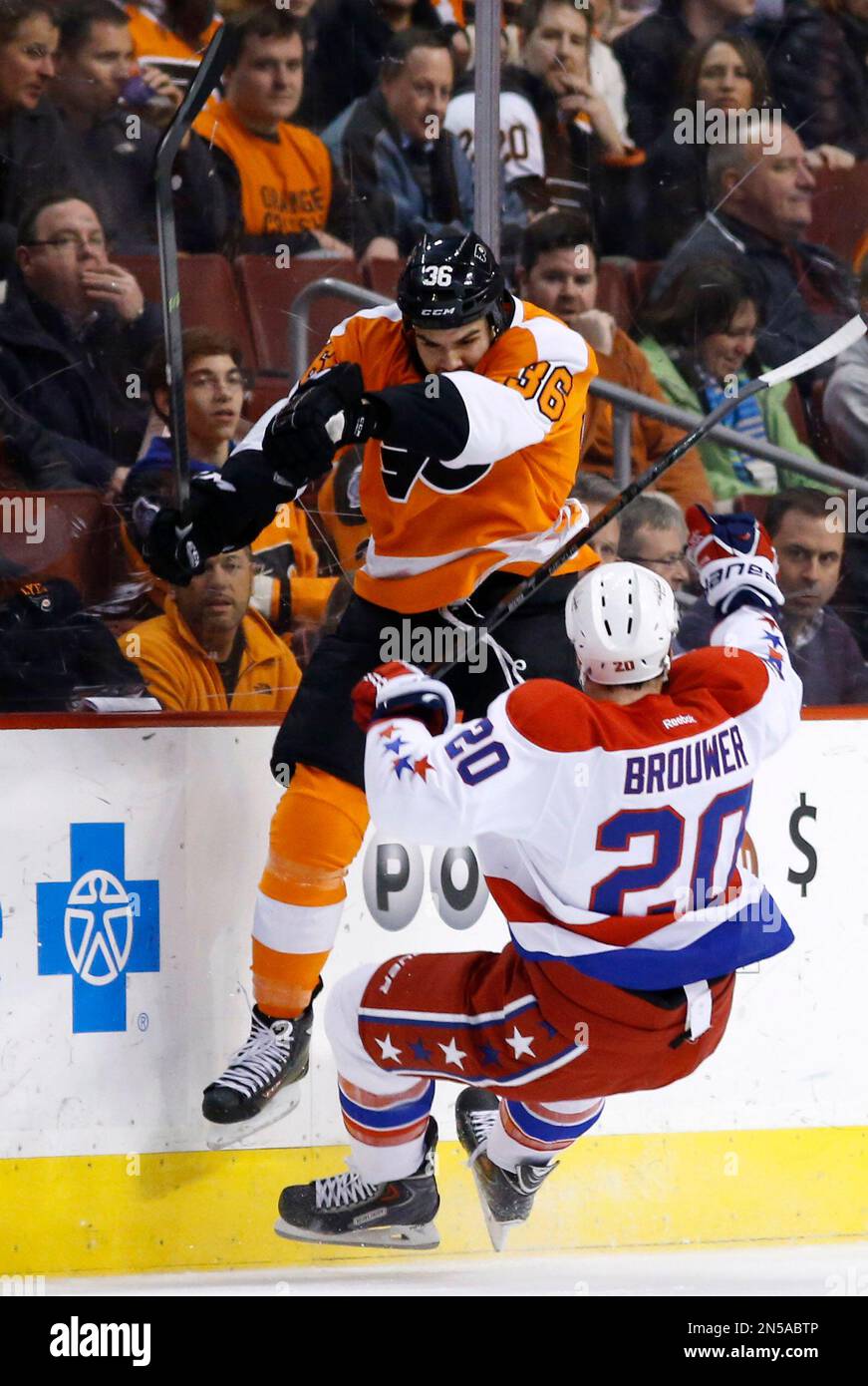 Philadelphia Flyers' Zac Rinaldo, left, collides with Washington ...