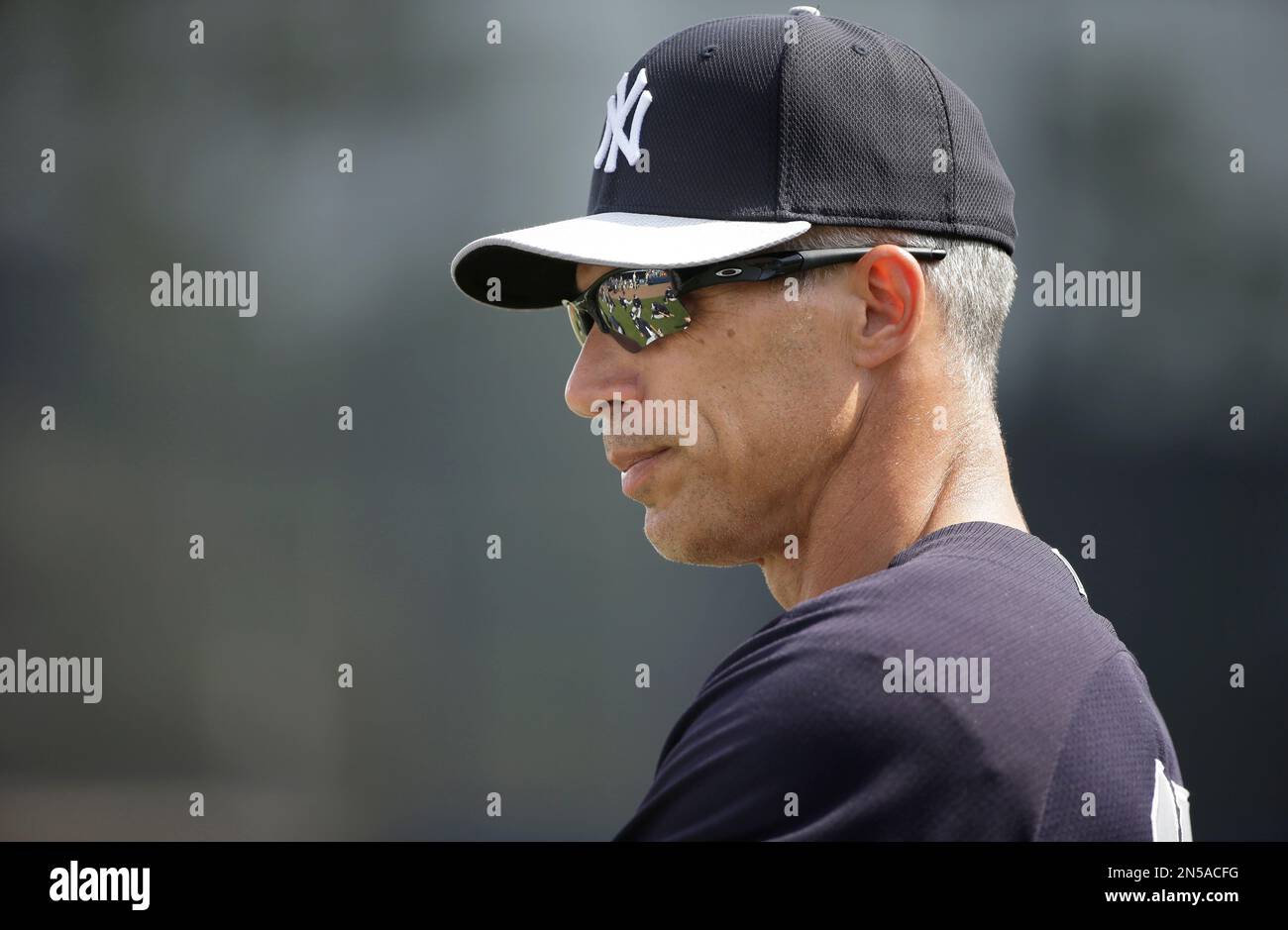 New York Yankees manager Joe Girardi, right, stands on the field before ...