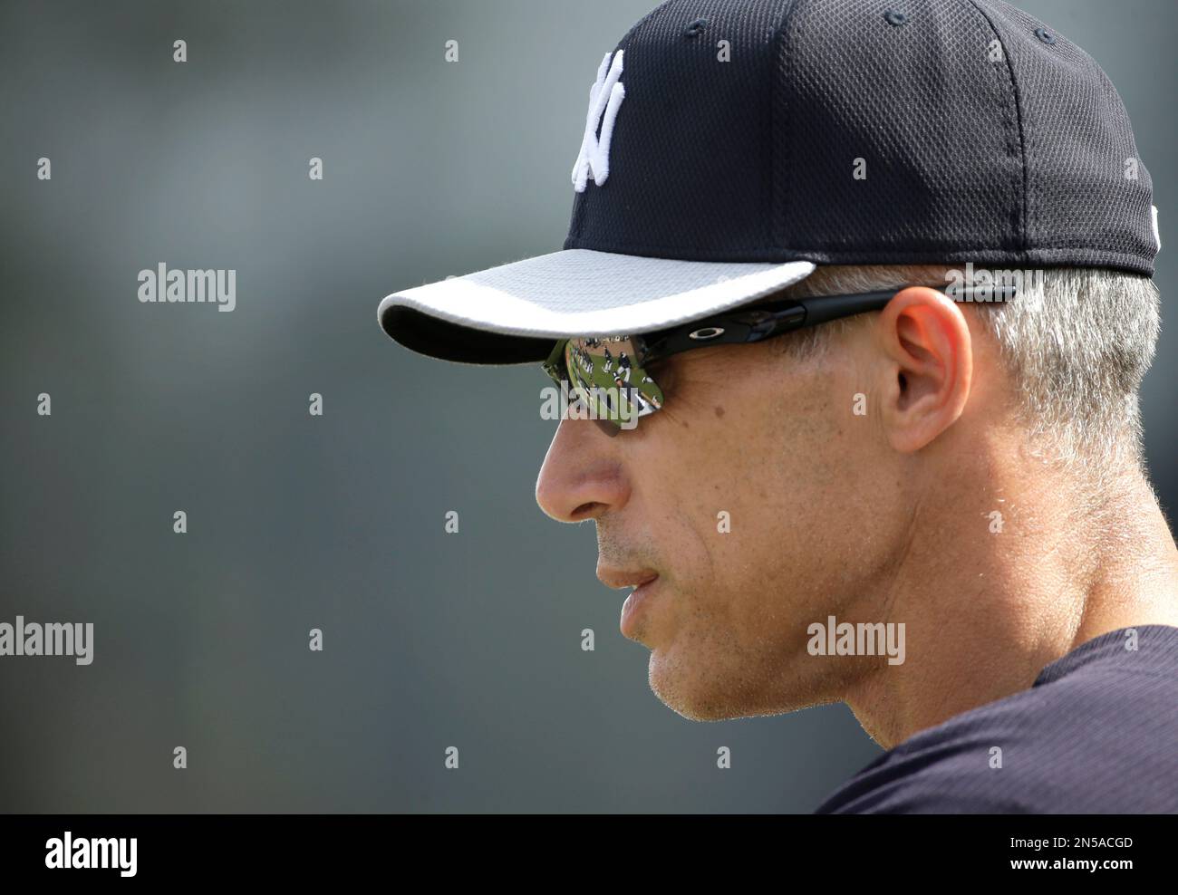 New York Yankees manager Joe Girardi, right, stands on the field before ...