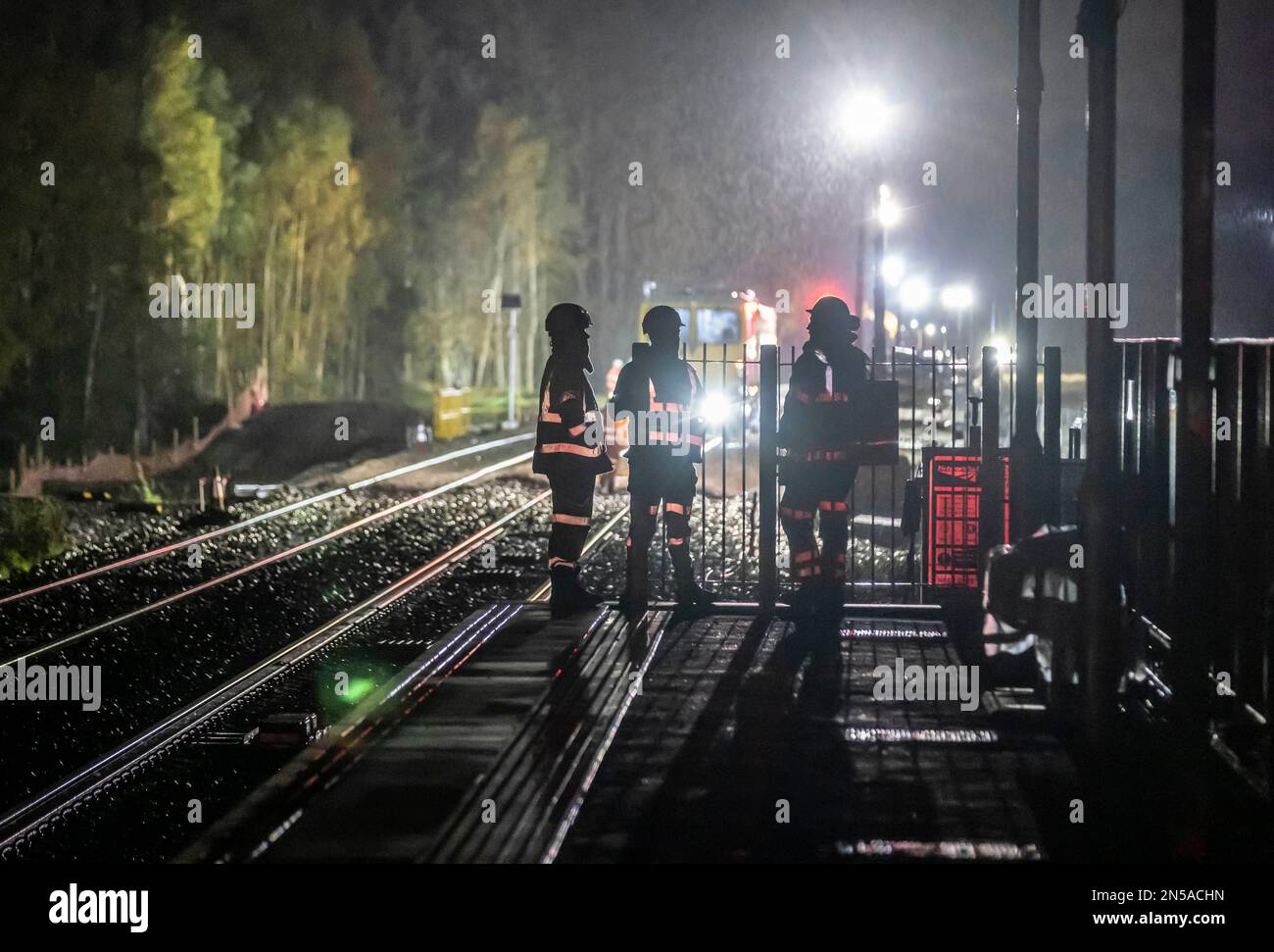 Railway workers building new railway and knocking down bridges Stock ...