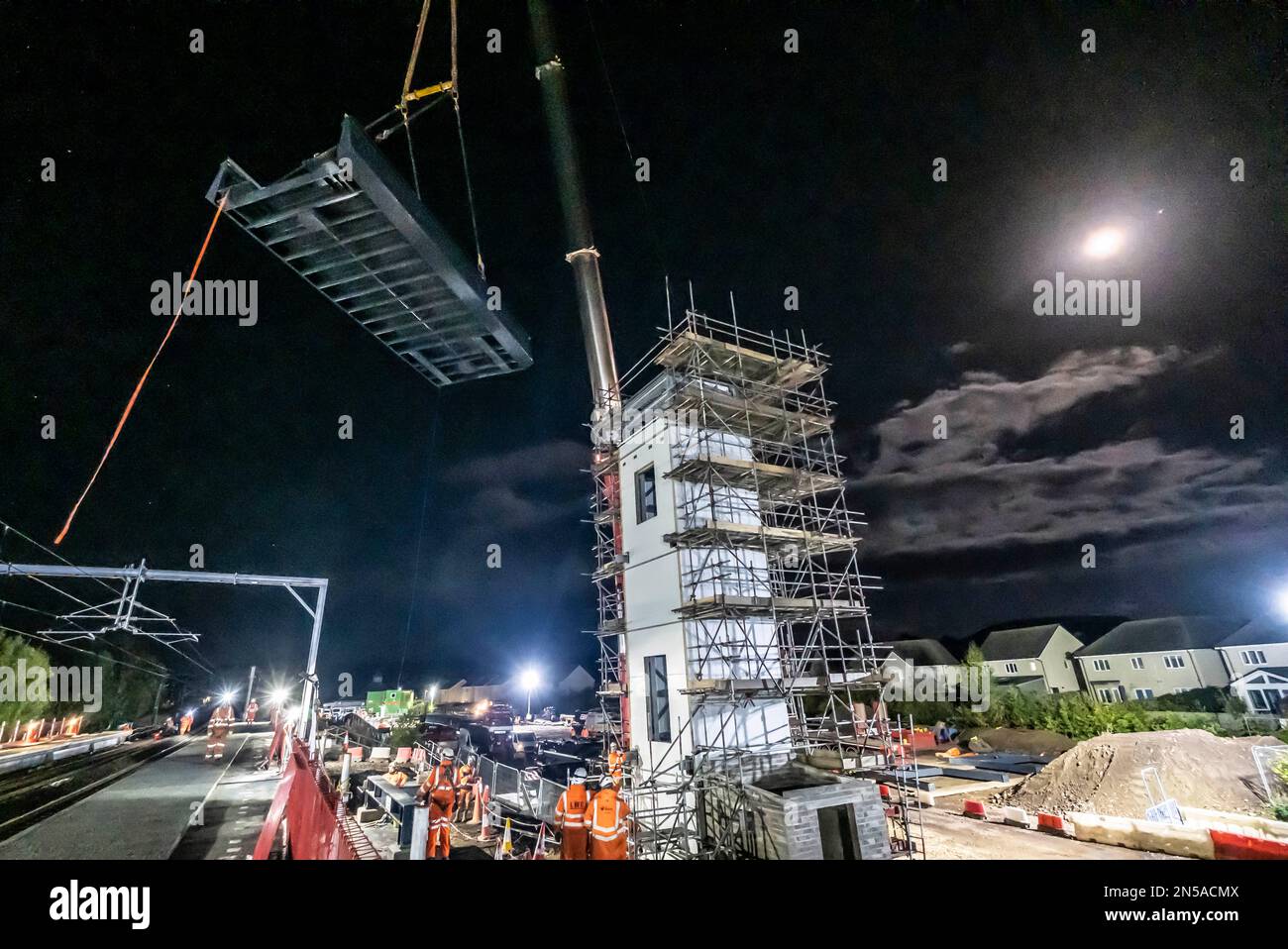 Railway workers building new railway and knocking down bridges Stock ...