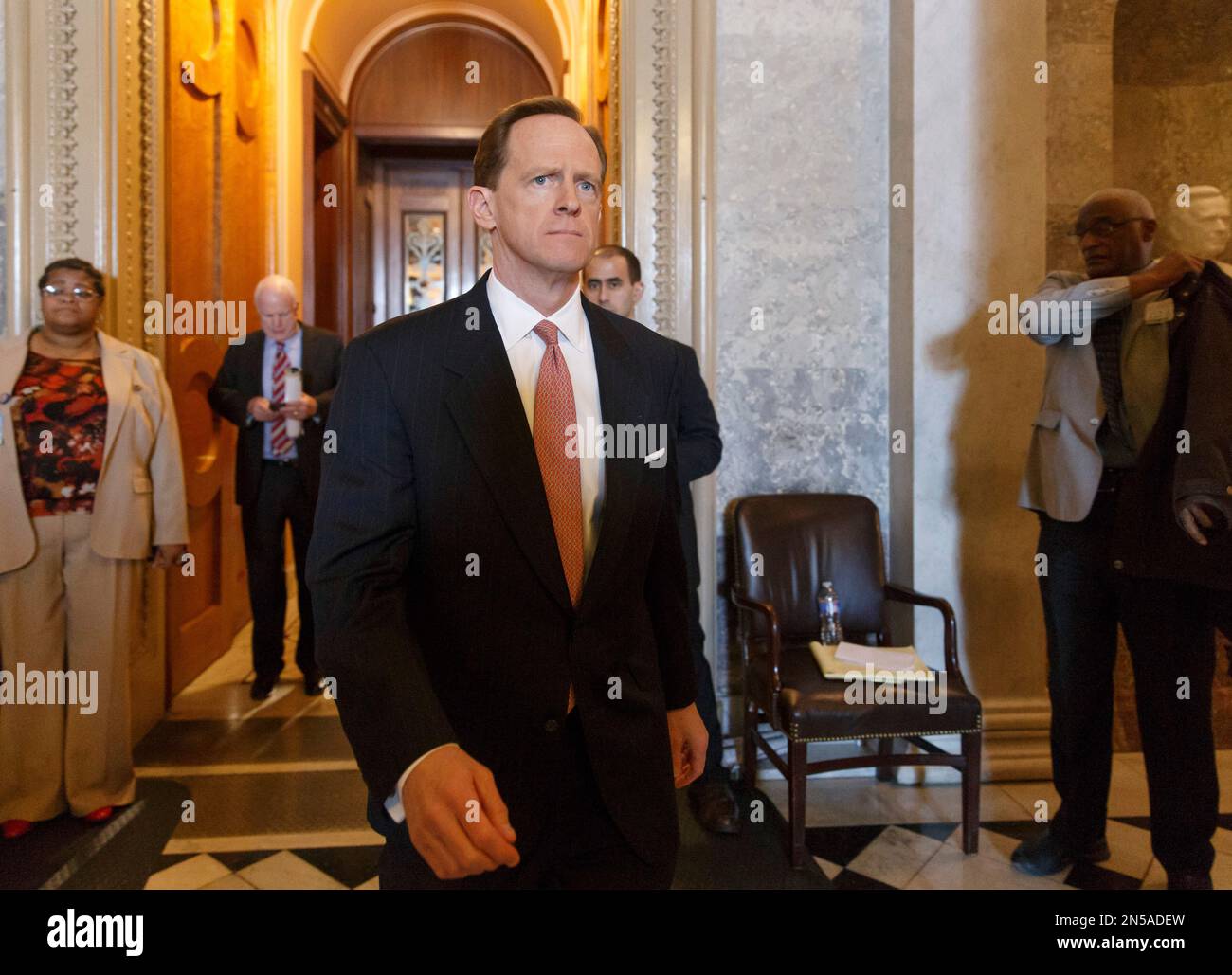 Sen. Pat Toomey, R-Pa., leaves the chamber just after President Barack ...